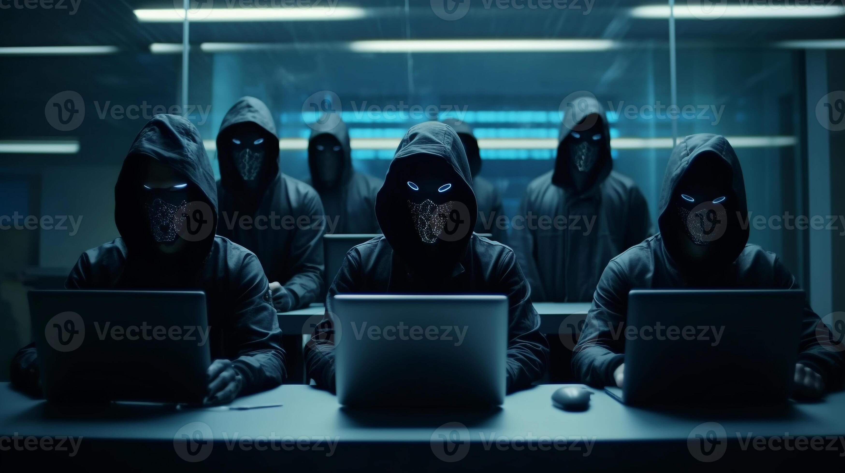 Hackers With Hoodies With Dark Face Mask Hacker Group Team In Front Laptop In Modern Office