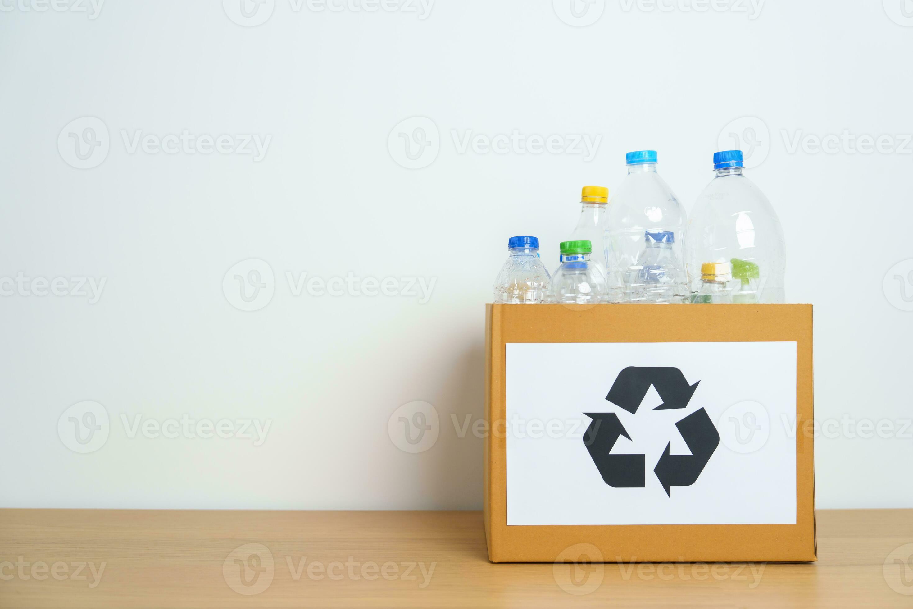 Plastic bottle in paper box at home or office. Recycle garbage Sorting ...