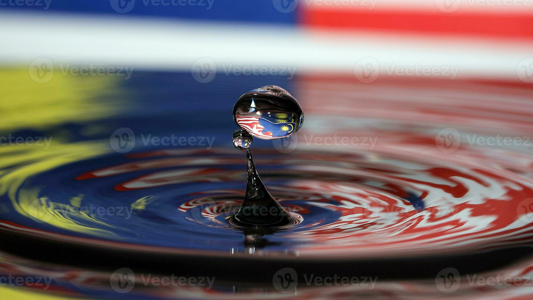Water droplet drop splash collision dripping pillar Malaysia Flag reflection refraction ...