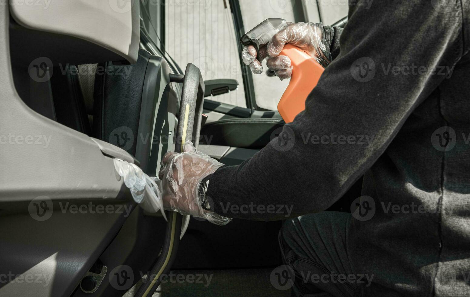 Men Spraying Coach Bus Railings With Antibacterial Liquid 24609923