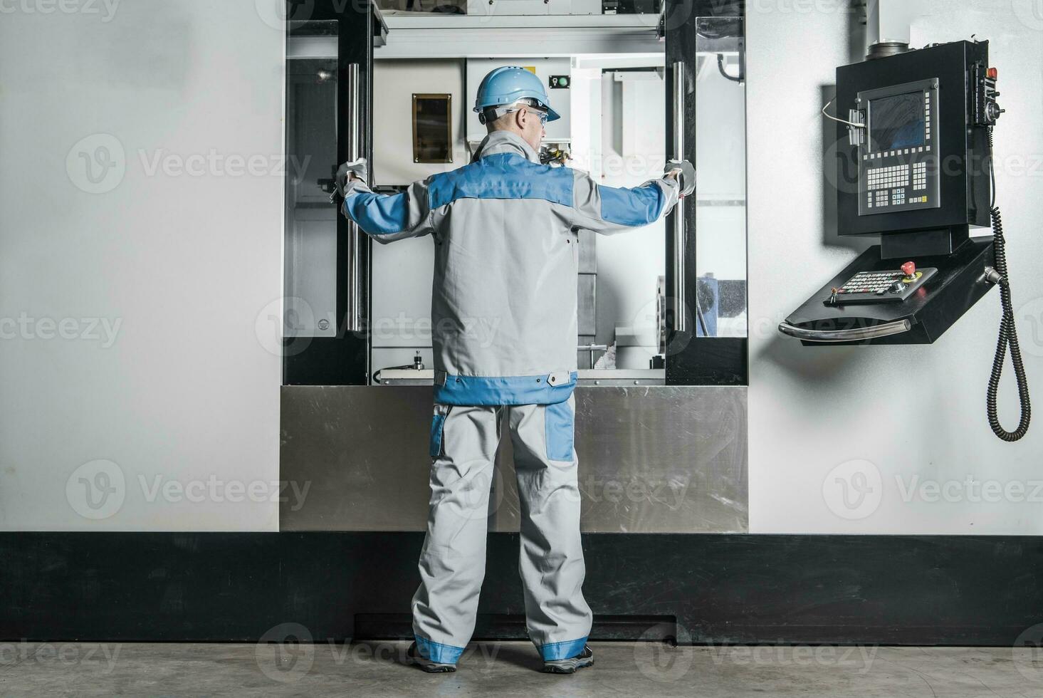 CNC Machine Operator 24612077 Stock Photo at Vecteezy