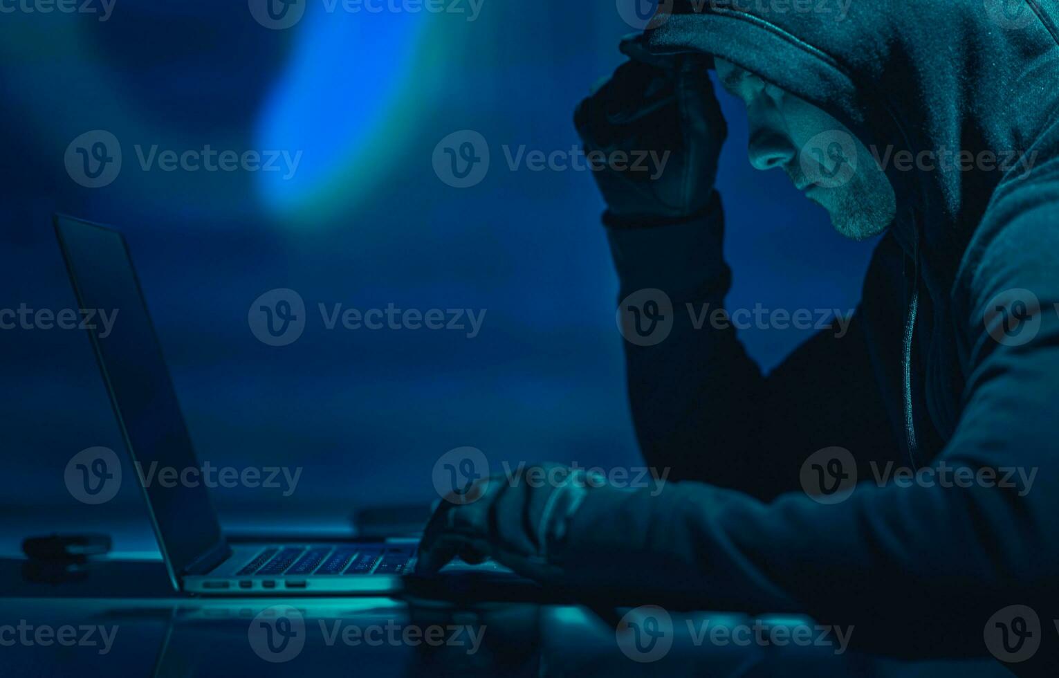 Hacker in Front of His Laptop Computer 24636915 Stock Photo at Vecteezy