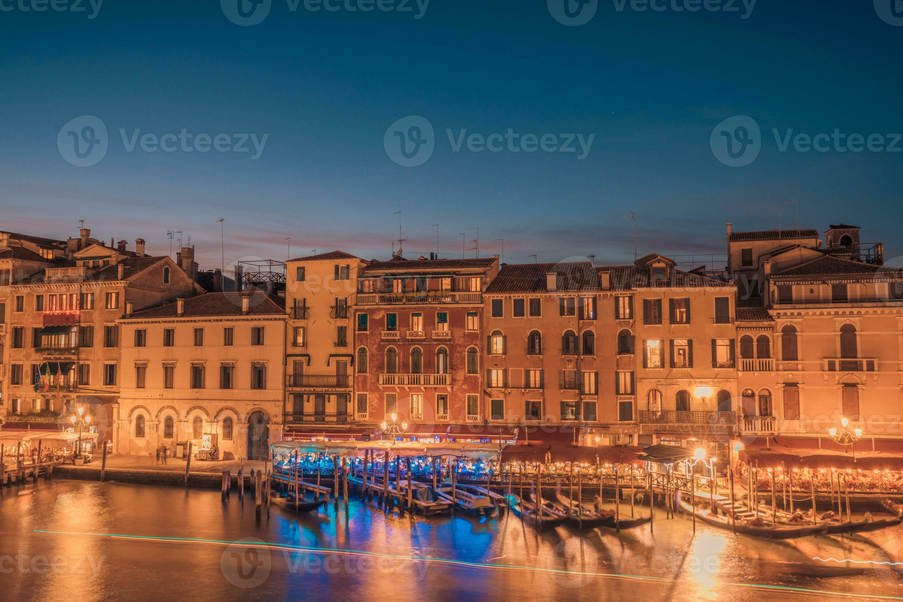 Grand Canal at night, Venice. Beautiful buildings and restaurants with ...