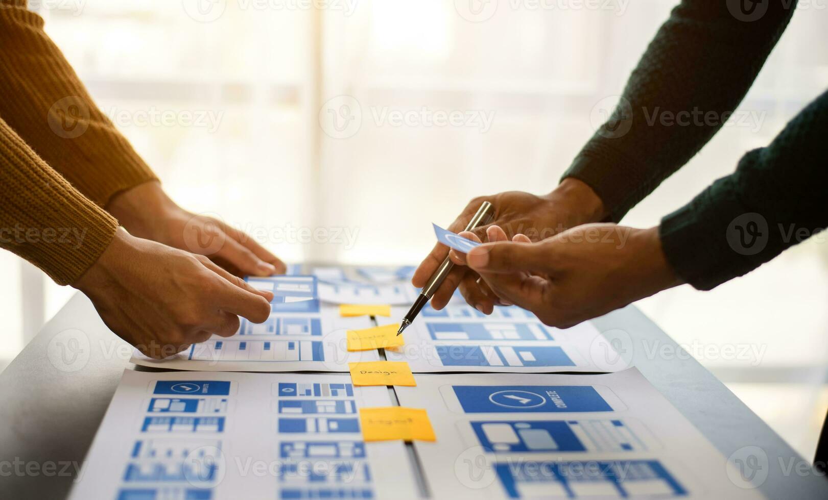 Ux Developer And Ui Designer Brainstorming About Mobile App Interface Wireframe Design With