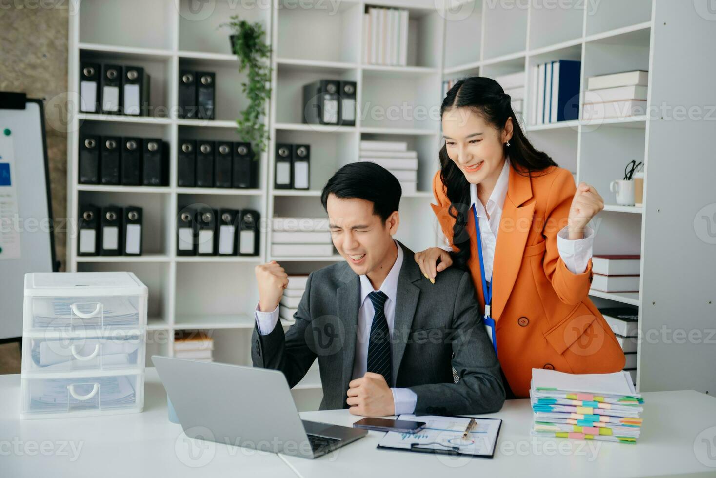 Young Asian business team creative businesspeople coworker, teamwork celebrating achievement and ...