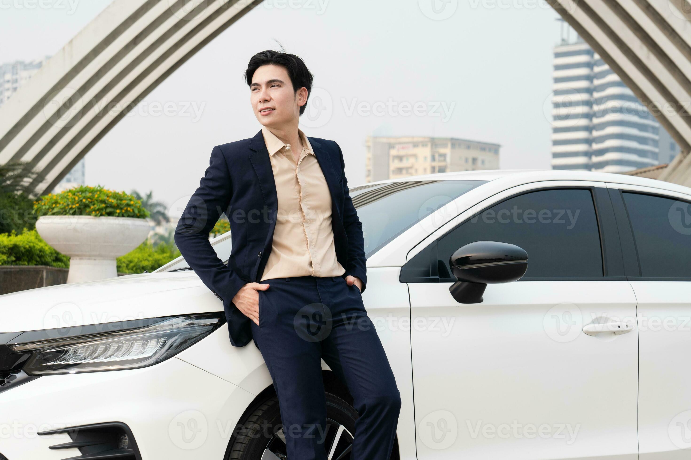 Young Asian business man with car 24705382 Stock Photo at Vecteezy