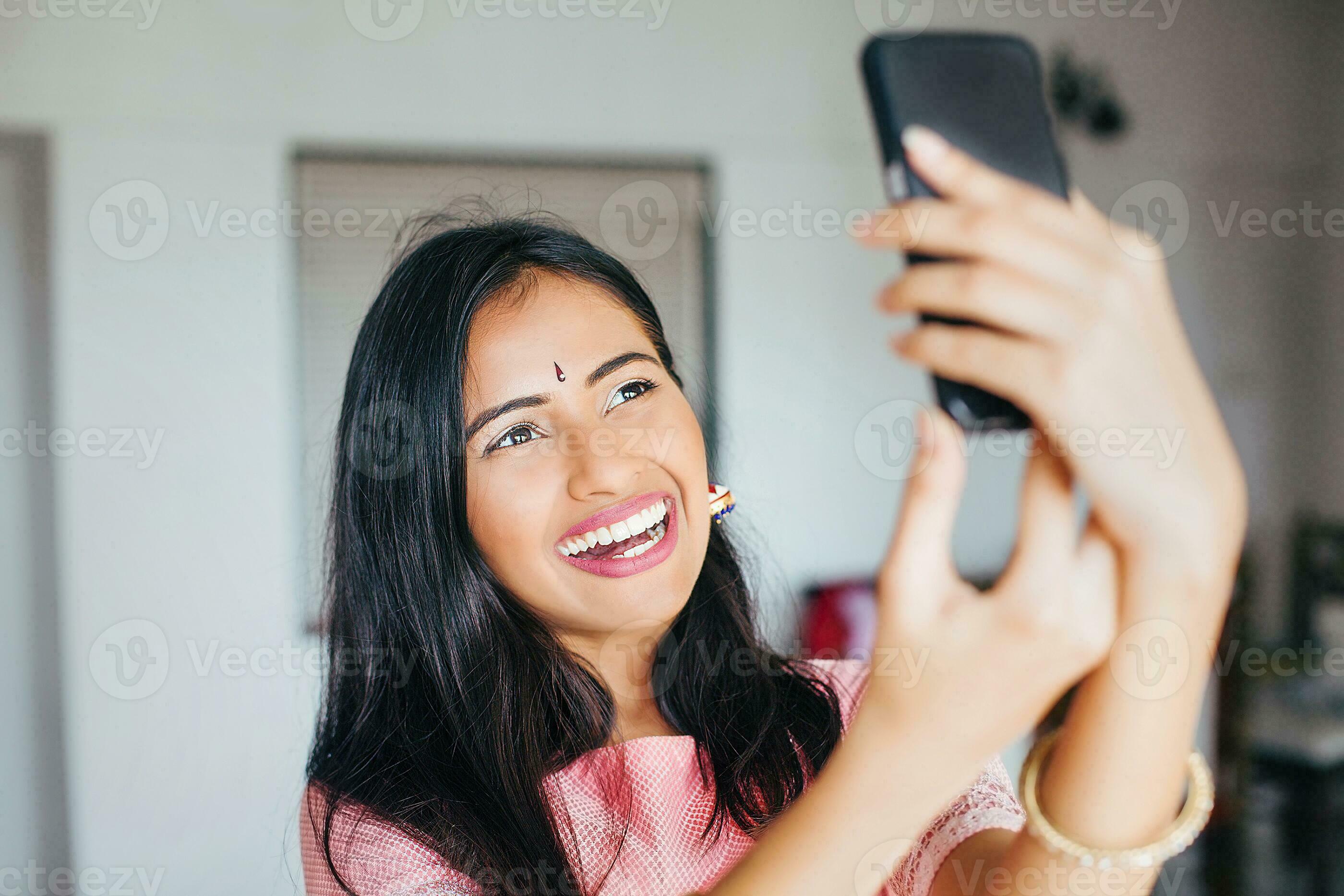 young beautiful happy indian woman wearing traditional taking a selfie 24753814 Stock Photo at ...