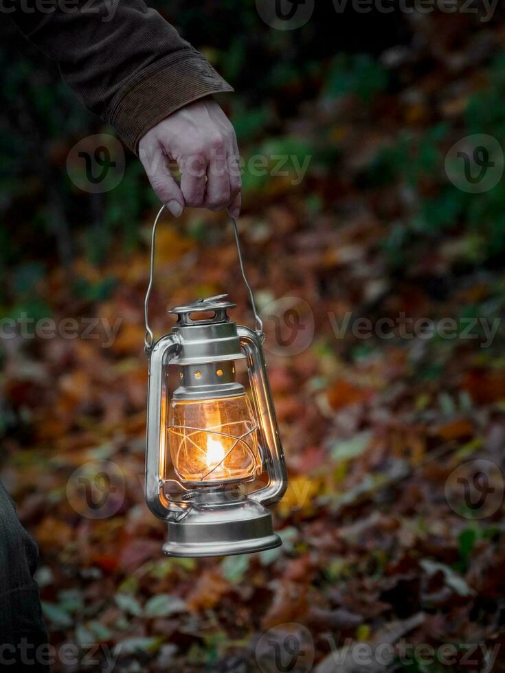 Yellow hanging lantern in hand at night. 24764102 Stock Photo at Vecteezy