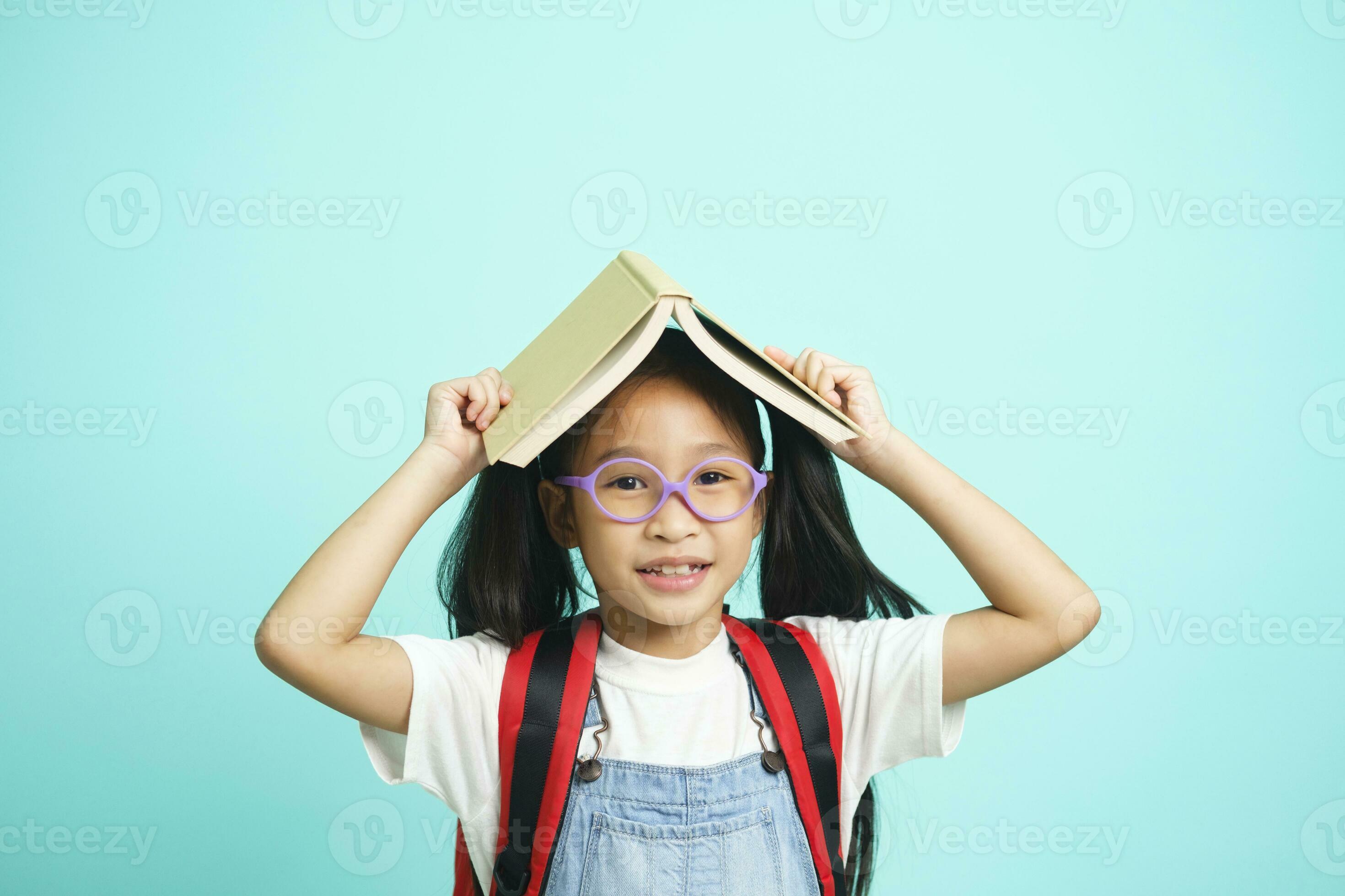 Kid students going to school, girl funny smiling, kid students girl with glasses hold books on ...
