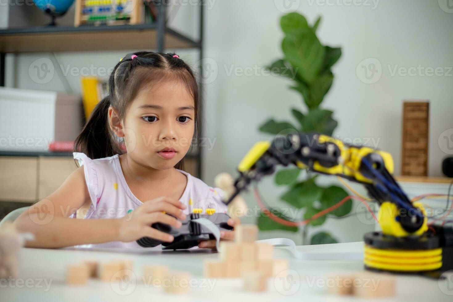 STEM education concept. Asian students learn at home by coding robot ...