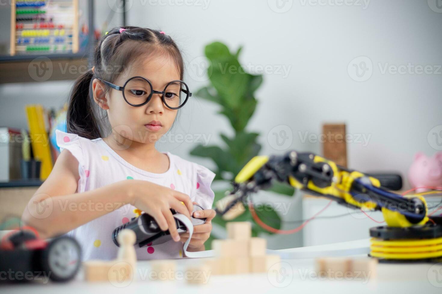 STEM education concept. Asian students learn at home by coding robot ...
