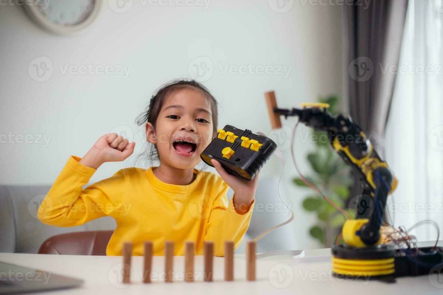 STEM education concept. Asian students learn at home by coding robot ...
