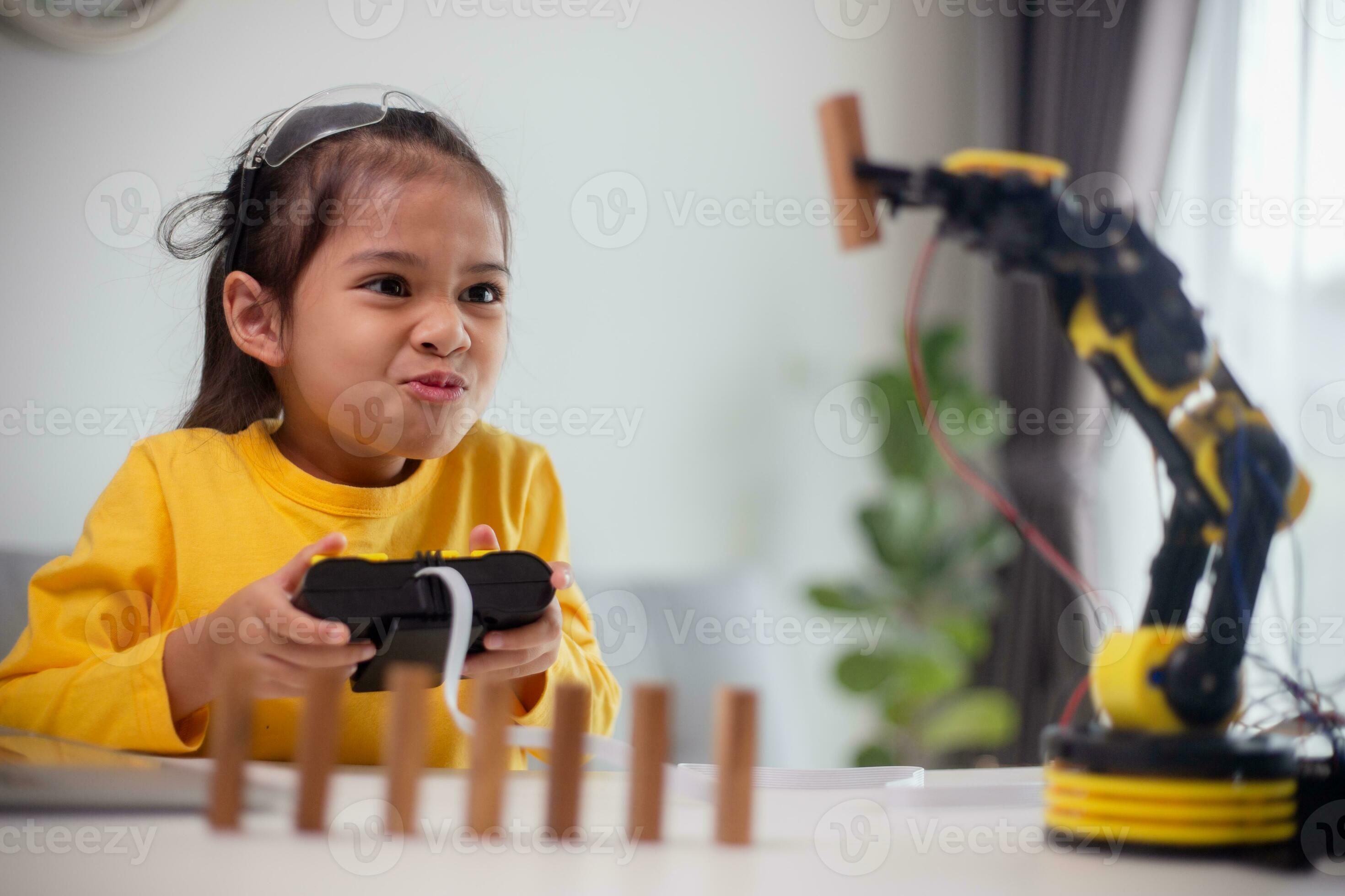 STEM education concept. Asian students learn at home by coding robot ...