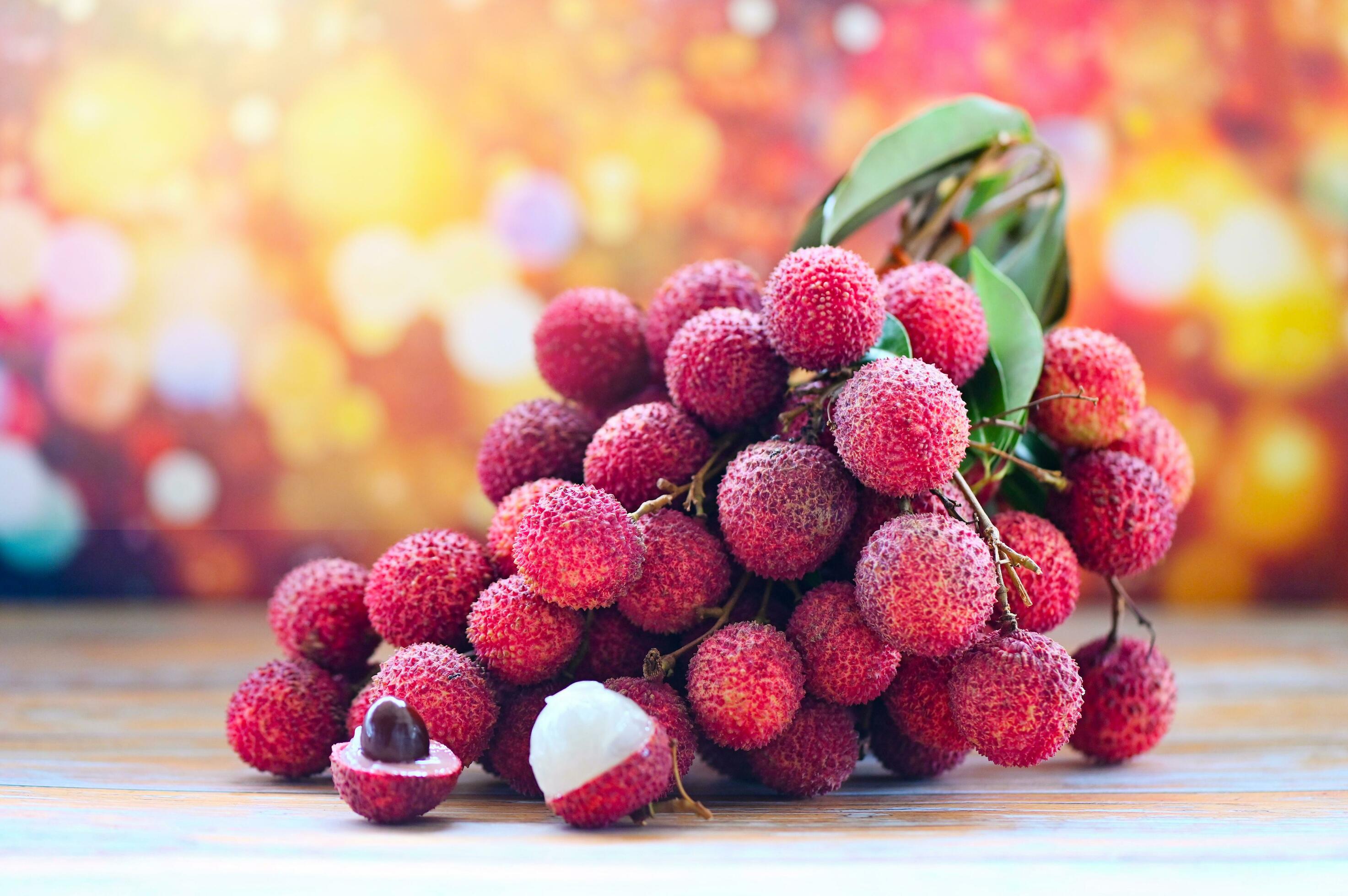lychees on table and colorful background, fresh ripe lychee fruit tropical fruit peeled lychees ...