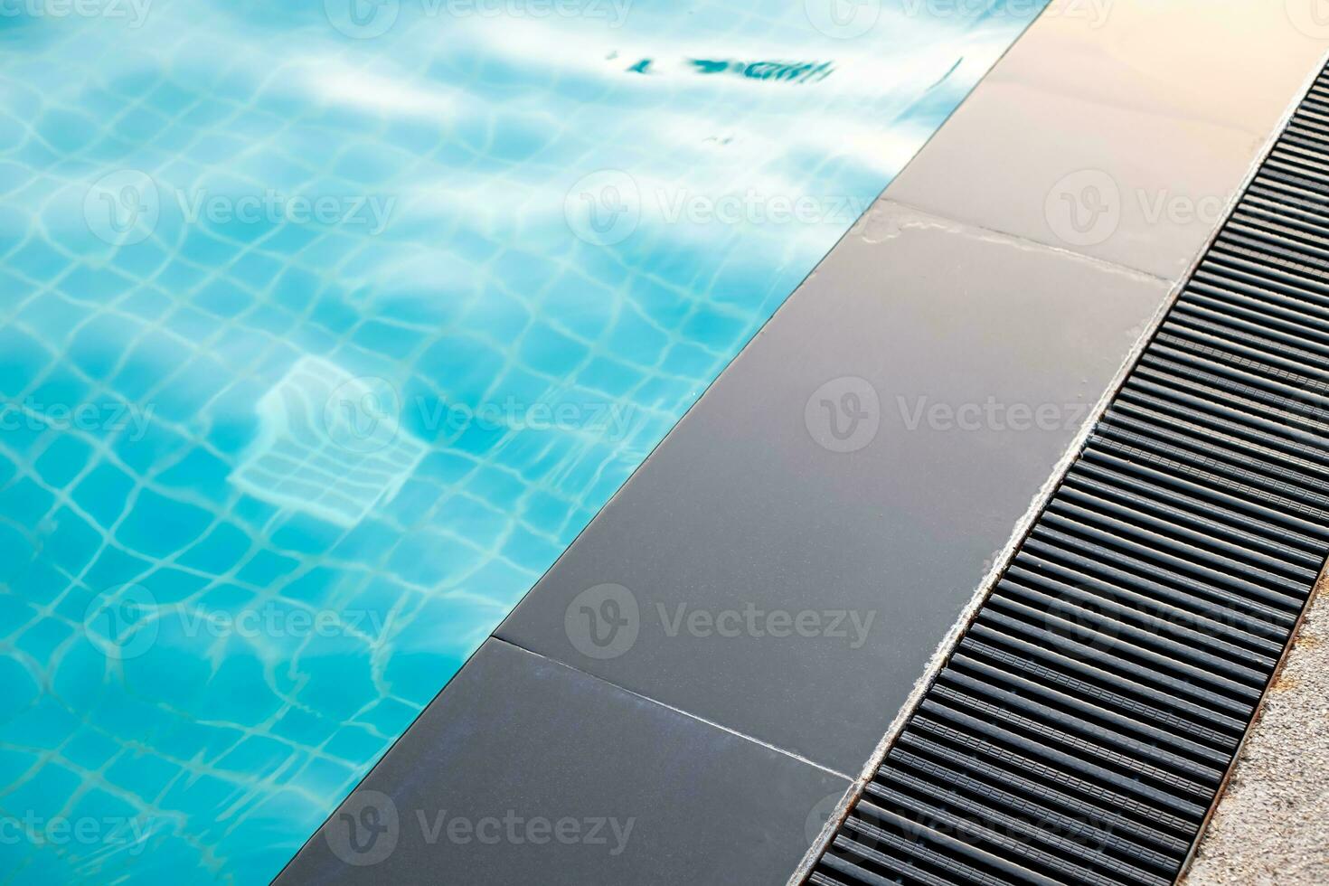 Black Gutter Is Installed Beside Swimming Pool Drainage System