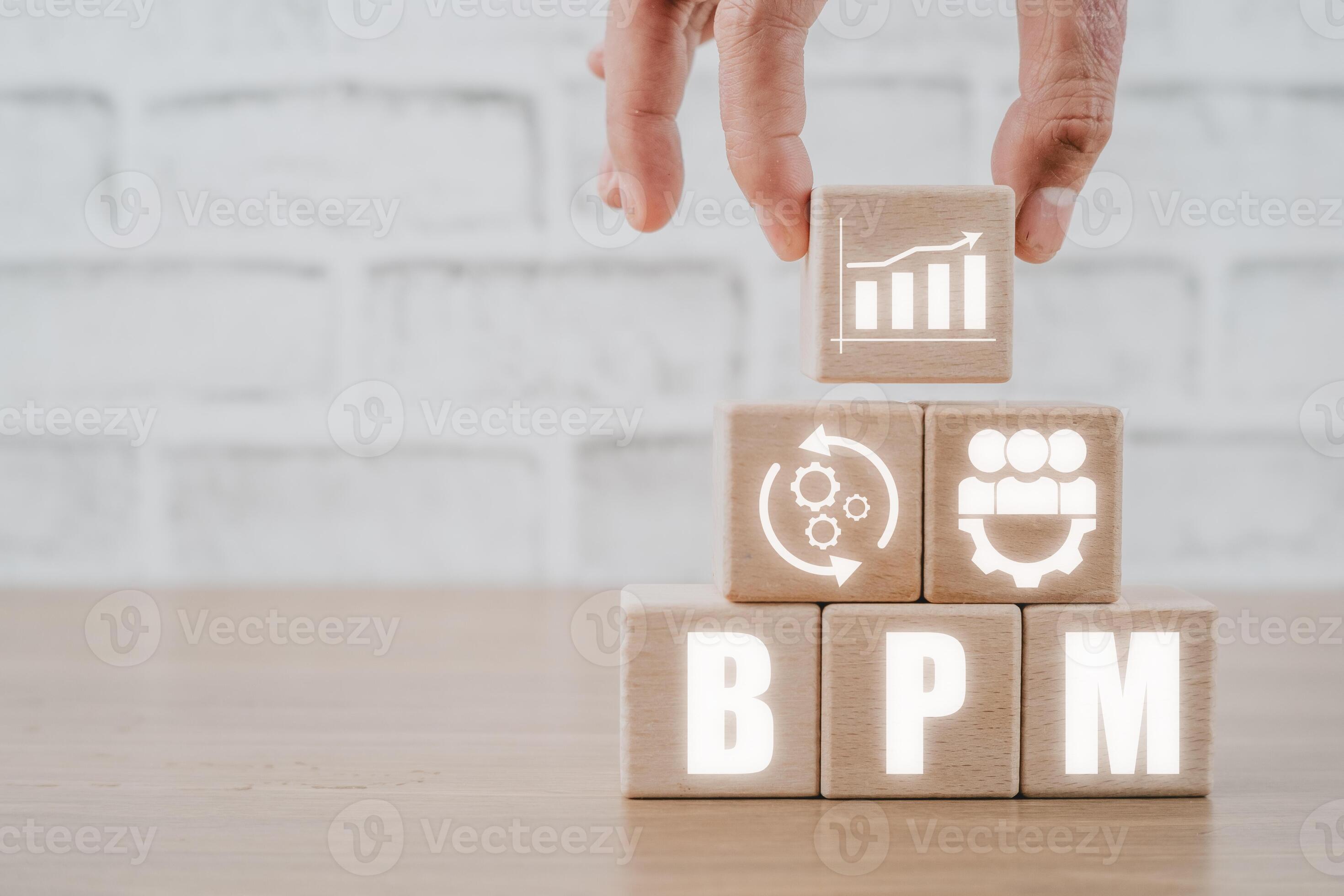 BPM, Business Process Management concept, Hand holding wooden block ... BPM, Business Process Management concept, Hand holding wooden block ...