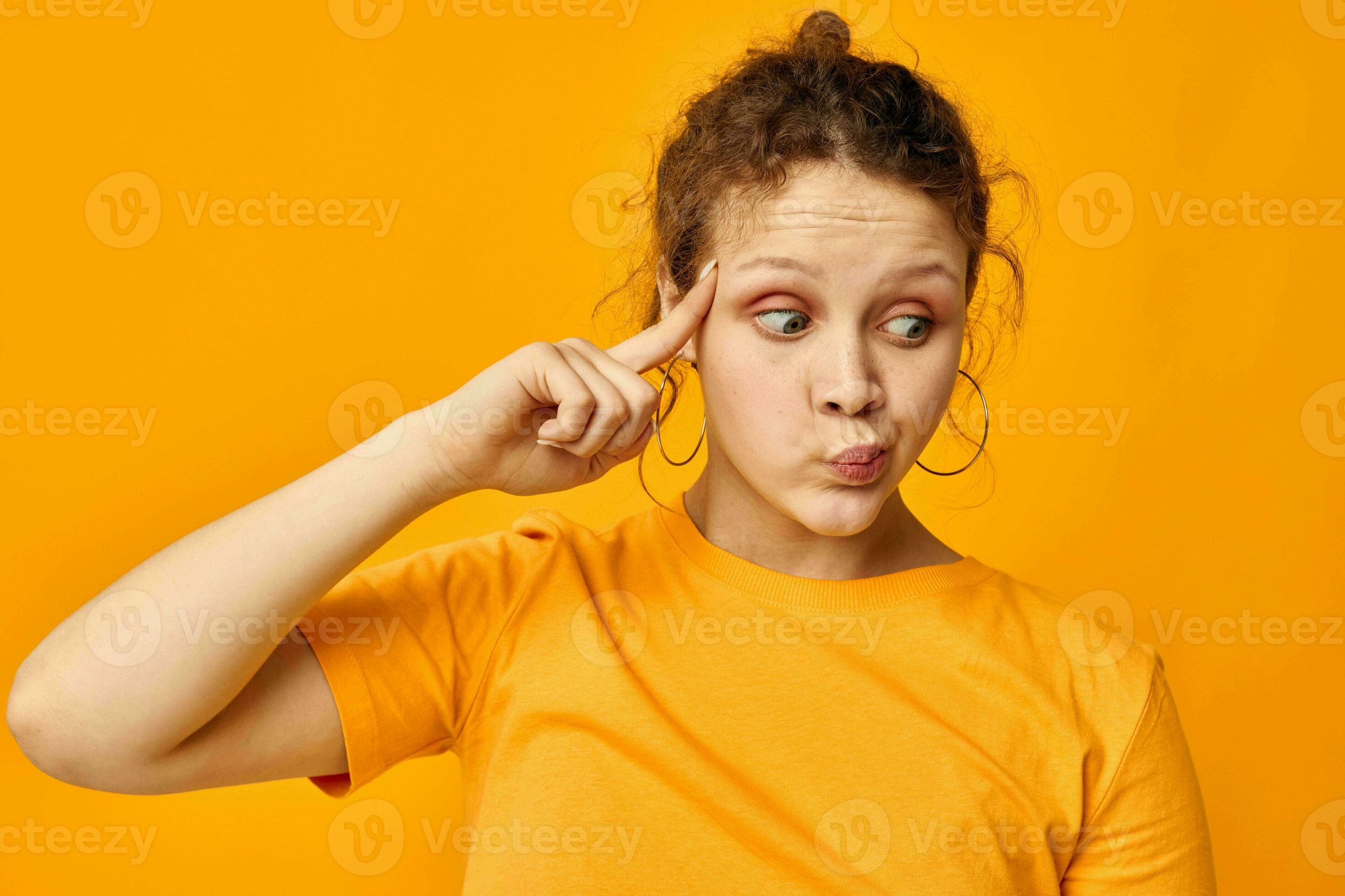 portrait of a young woman gestures with hands grimace emotions isolated ...