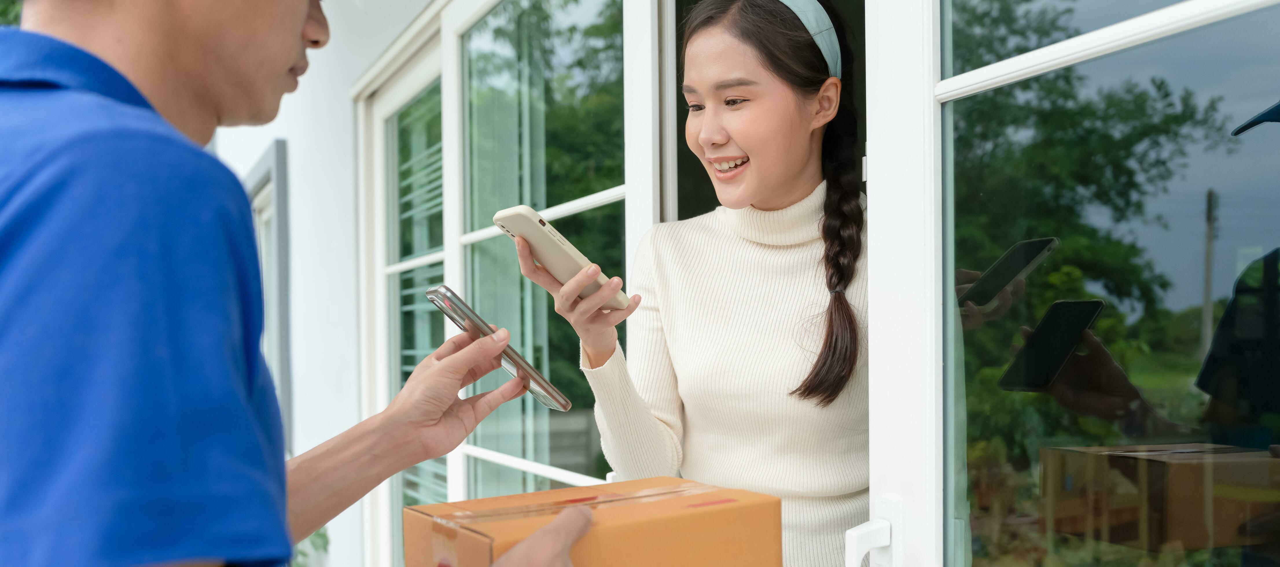 Happy smile Asian woman scan QR code for pay of food. Delivery man send deliver express. online ...