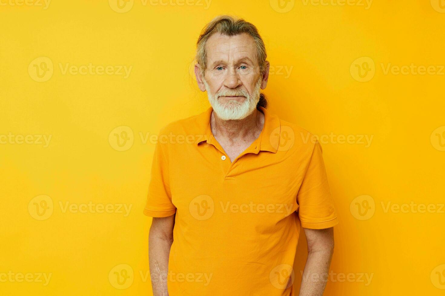 Portrait of happy senior man hand gesture gray beard fun yellow ...