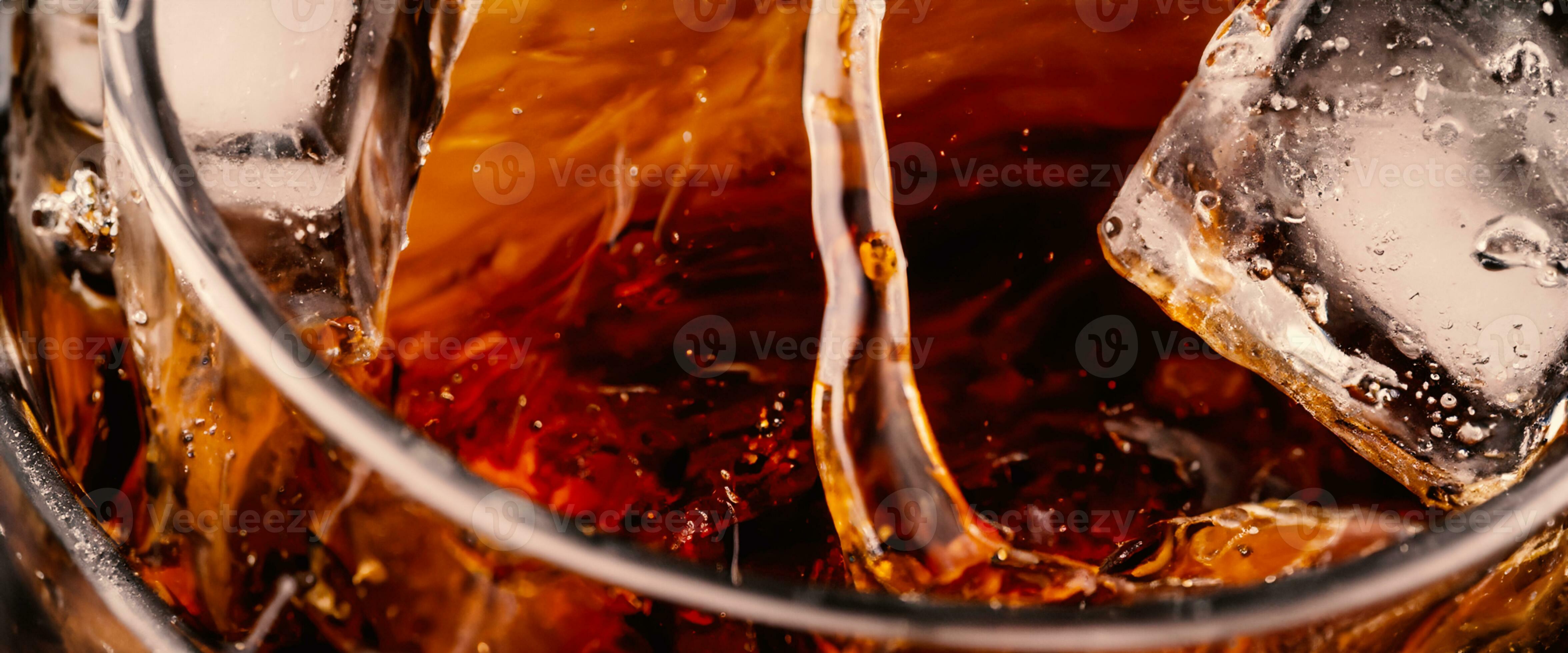 Splashing of Cola and Ice. Cola soda and ice splashing fizzing or floating up to top of surface ...