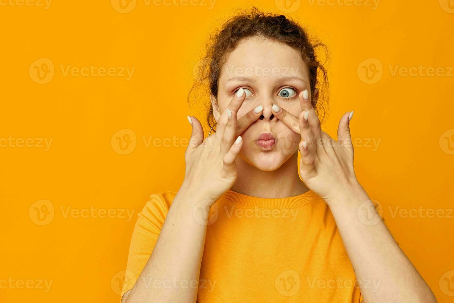 portrait of a young woman gestures with hands grimace emotions isolated ...