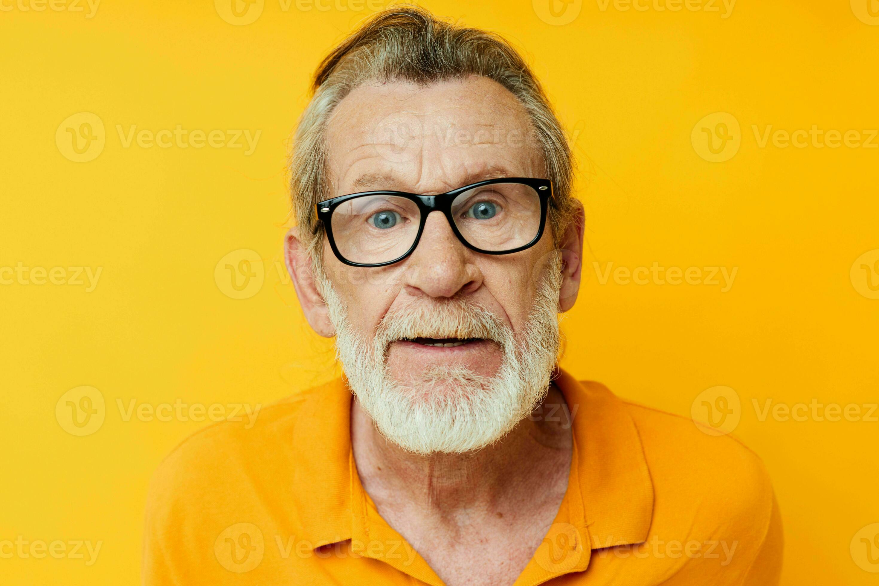 Senior Grey Haired Man Wearing Glasses Yellow Shirt Posing Isolated