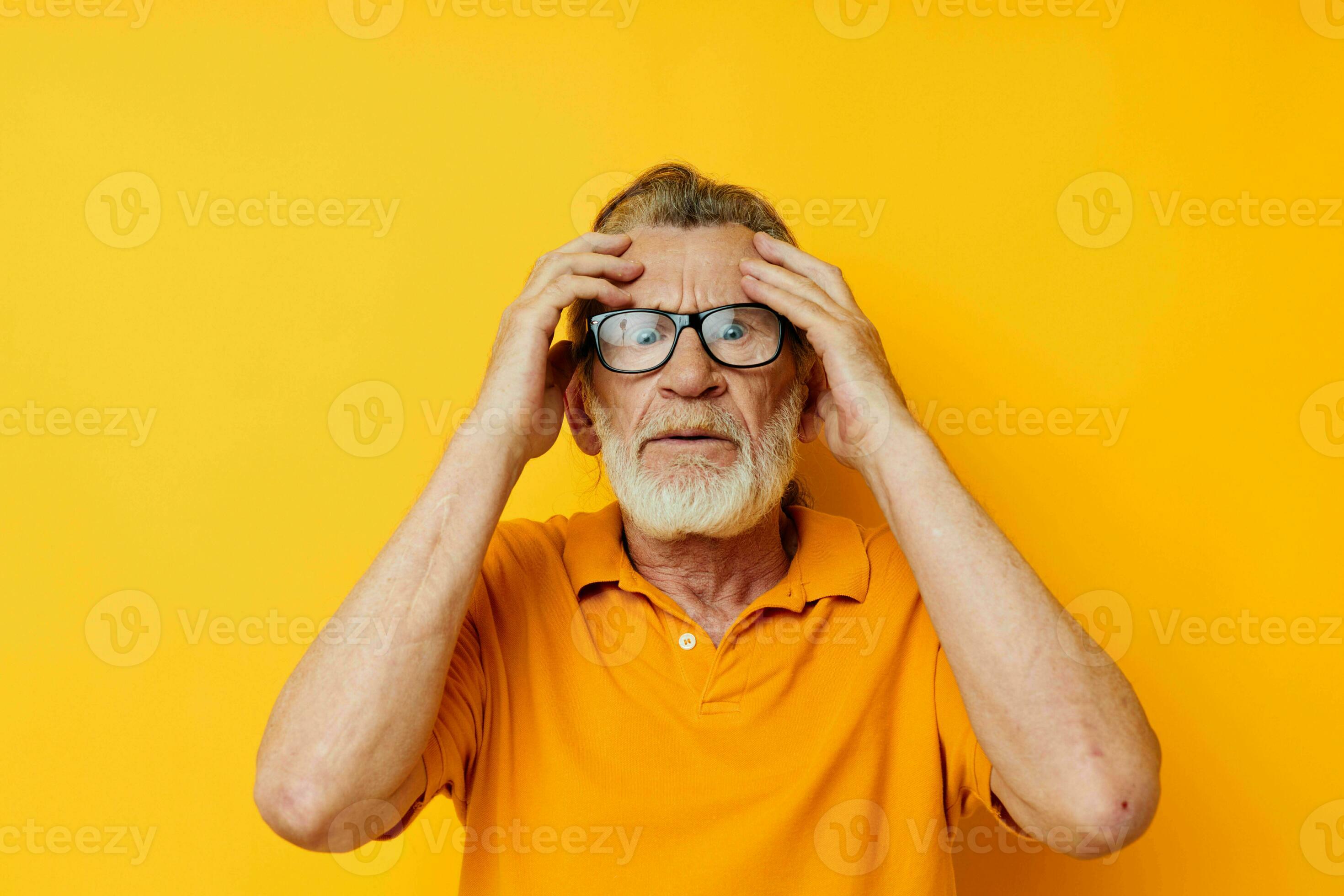 Senior Grey Haired Man Posing Yellow Tshirt Glasses Yellow Background
