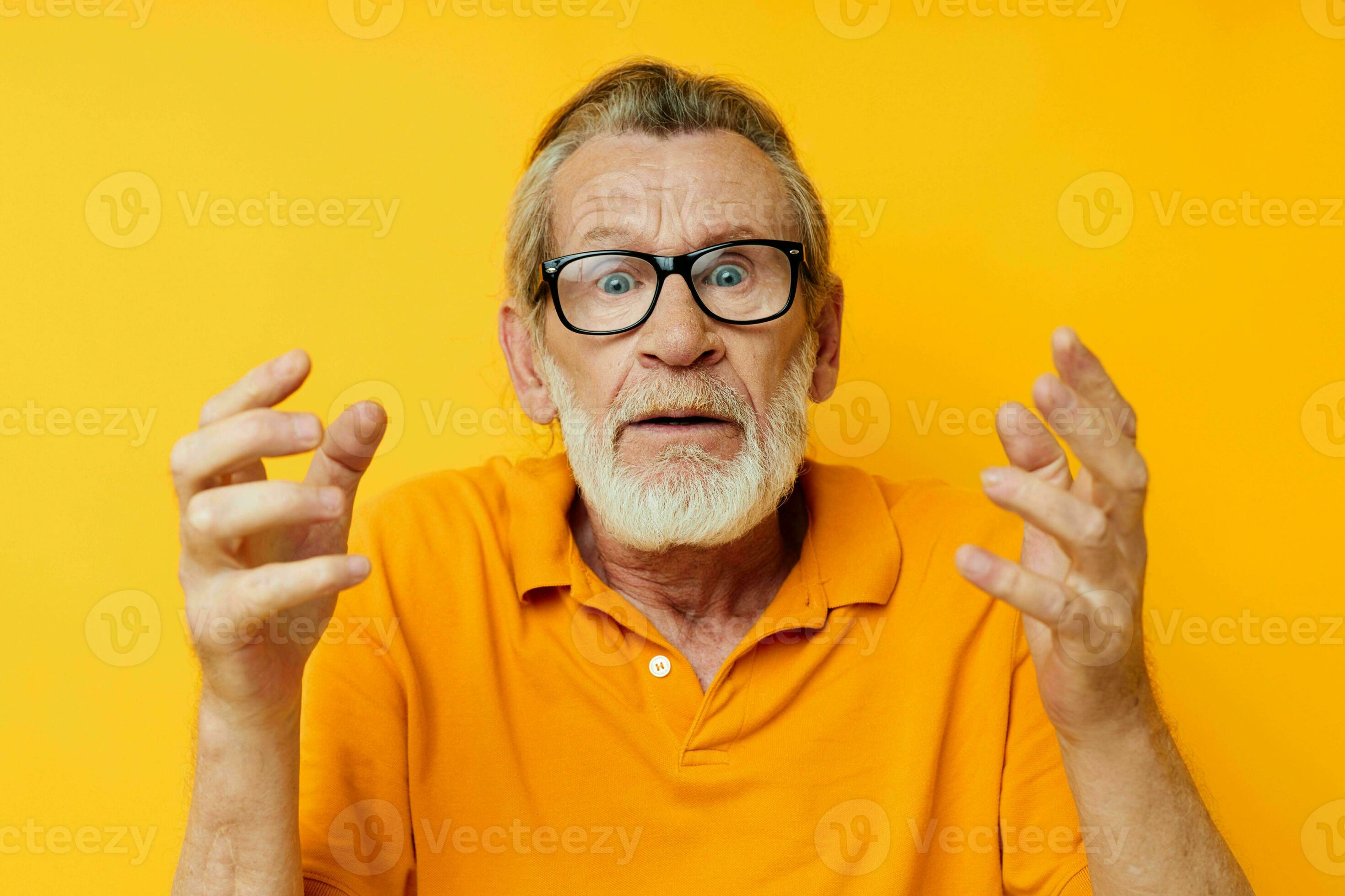Portrait Elderly Man Posing Yellow Tshirt Glasses Yellow Background