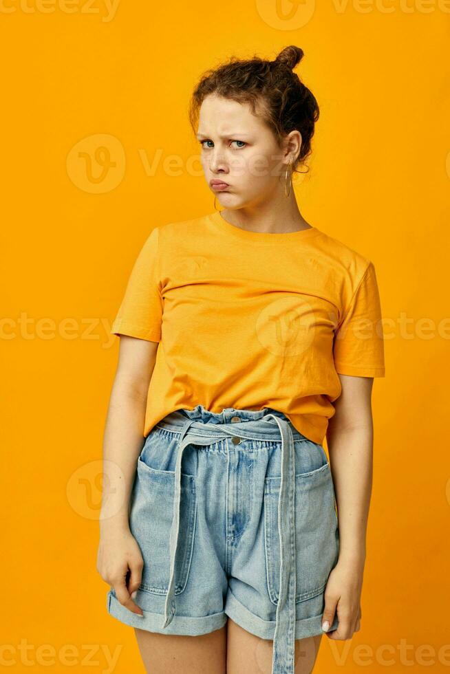 Pretty Woman In A Yellow T Shirt Posing Emotions Isolated Backgrounds