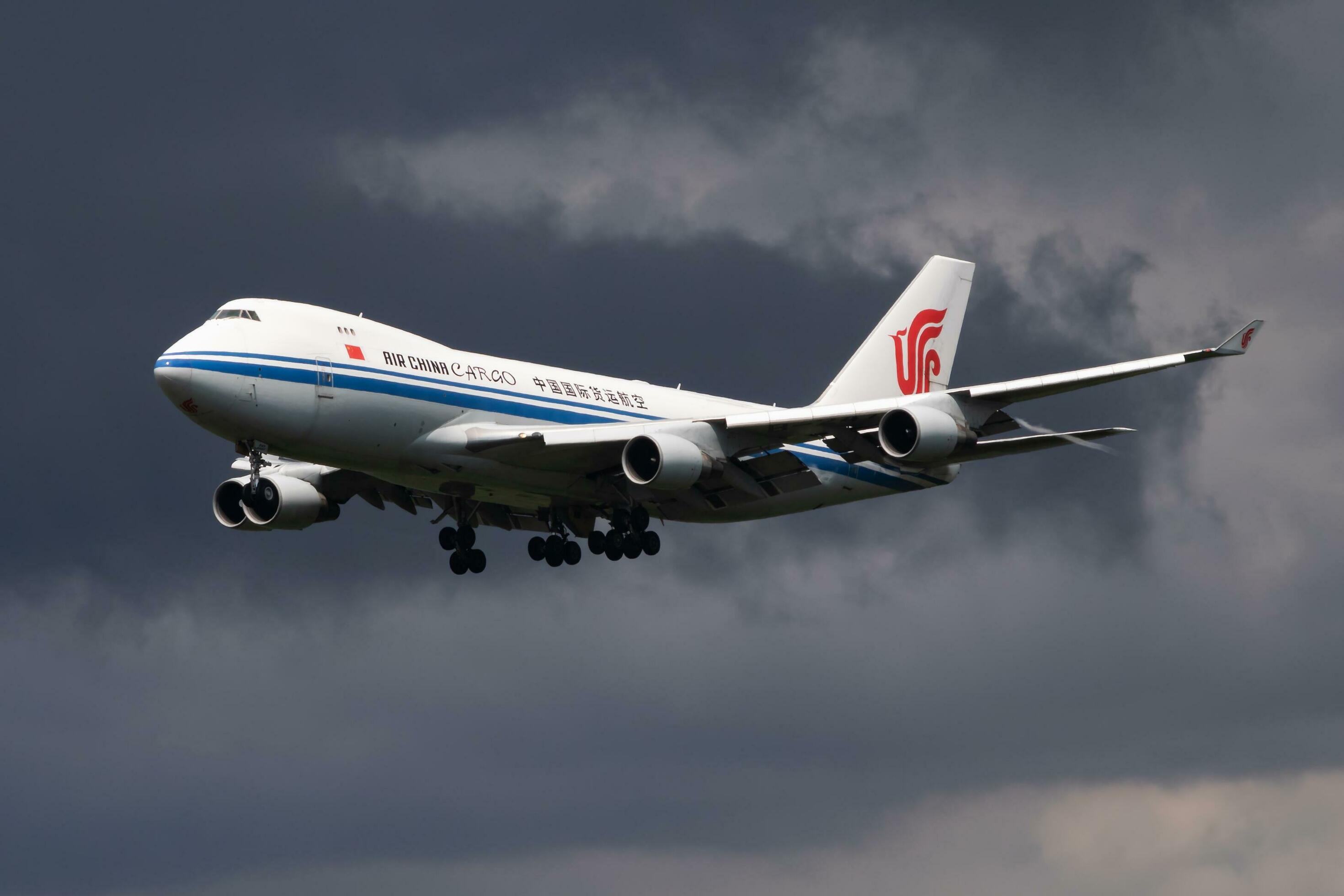 Air China cargo plane at airport. Air freight shipping. Aviation and aircraft. Air transport ...