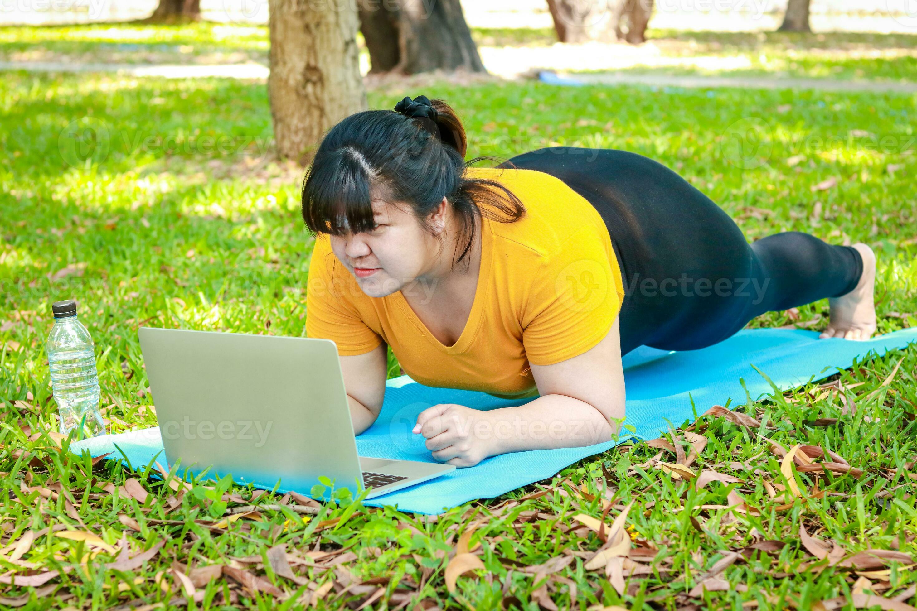 Fat Asian Woman Lying Exercise On The Grass In The Park Watch Online