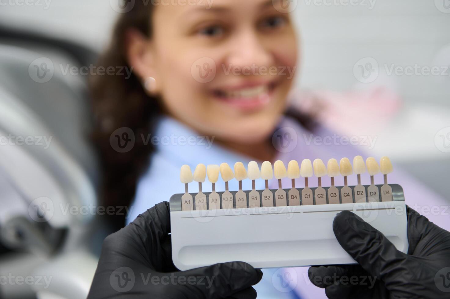 Selective Focus On Tooth Color Chart In The Hands Of A Dentist
