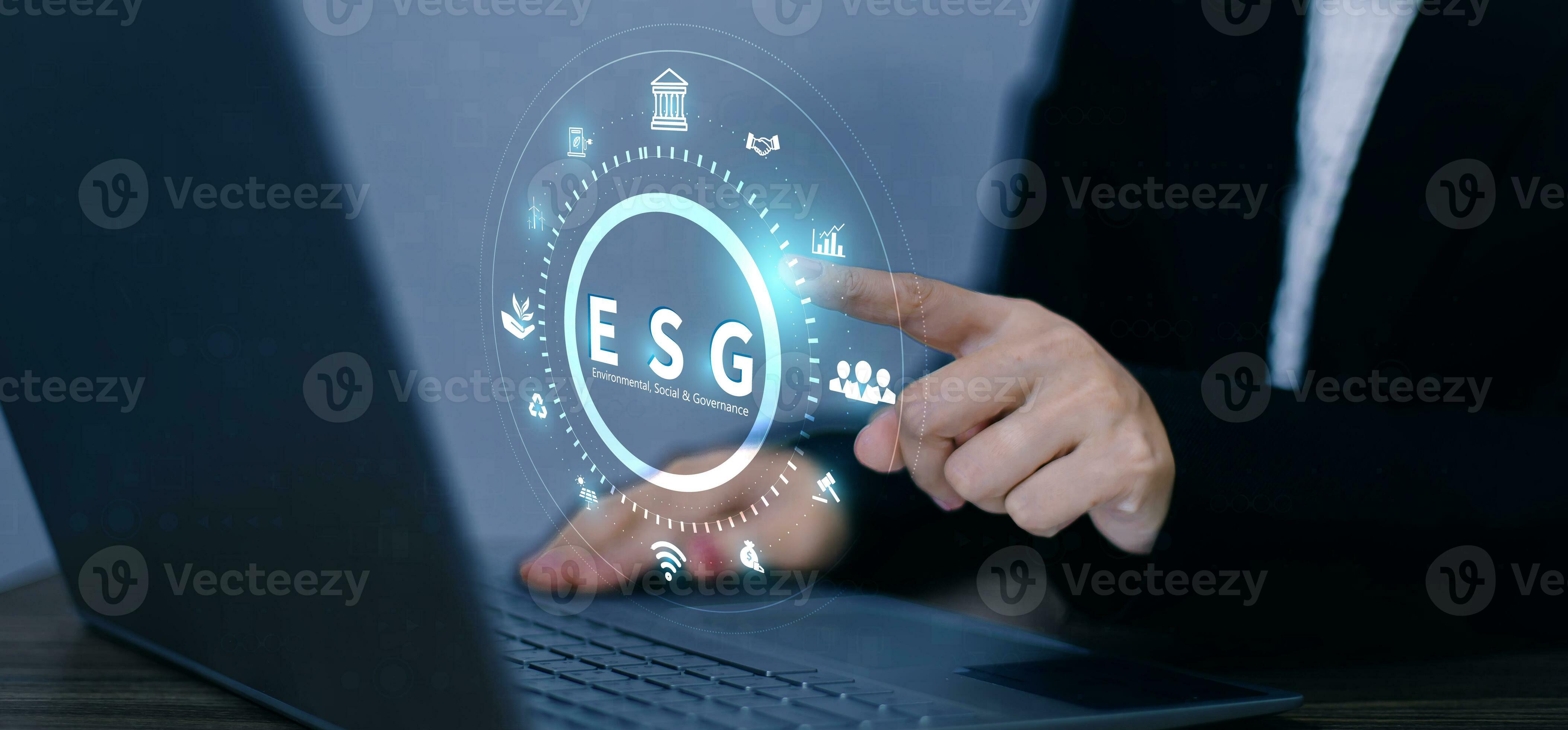 ESG. environment social governance investment business concept. Businessmen use a computer to ...