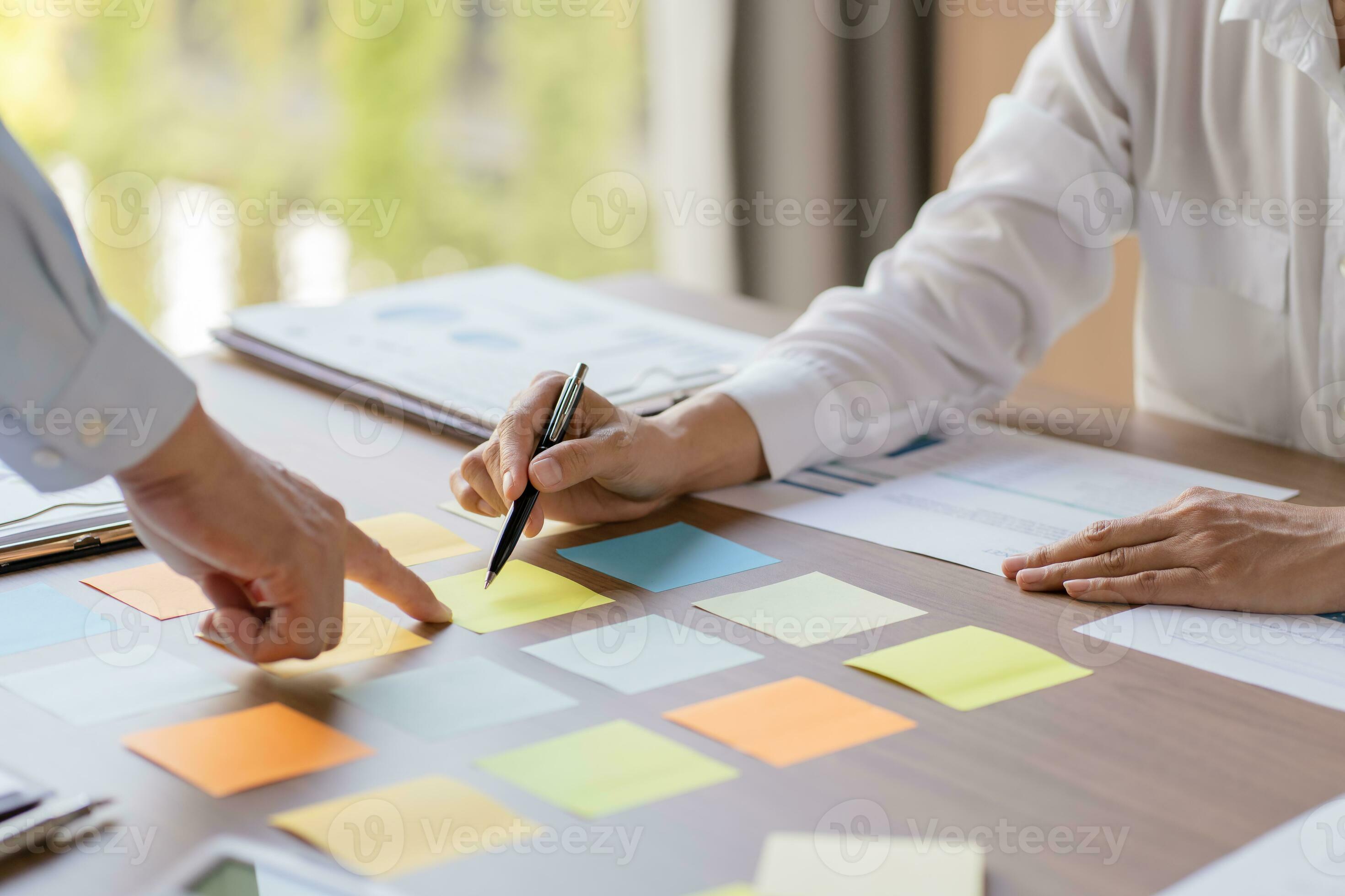 Business People brainstorming Meeting Design Ideas use post it notes to ...