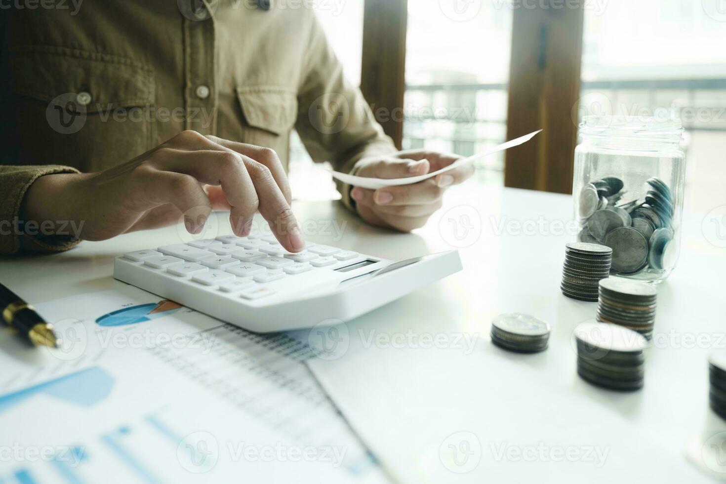 Accountant using calculator for calculate finance report in office ... Accountant using calculator for calculate finance report in office ...