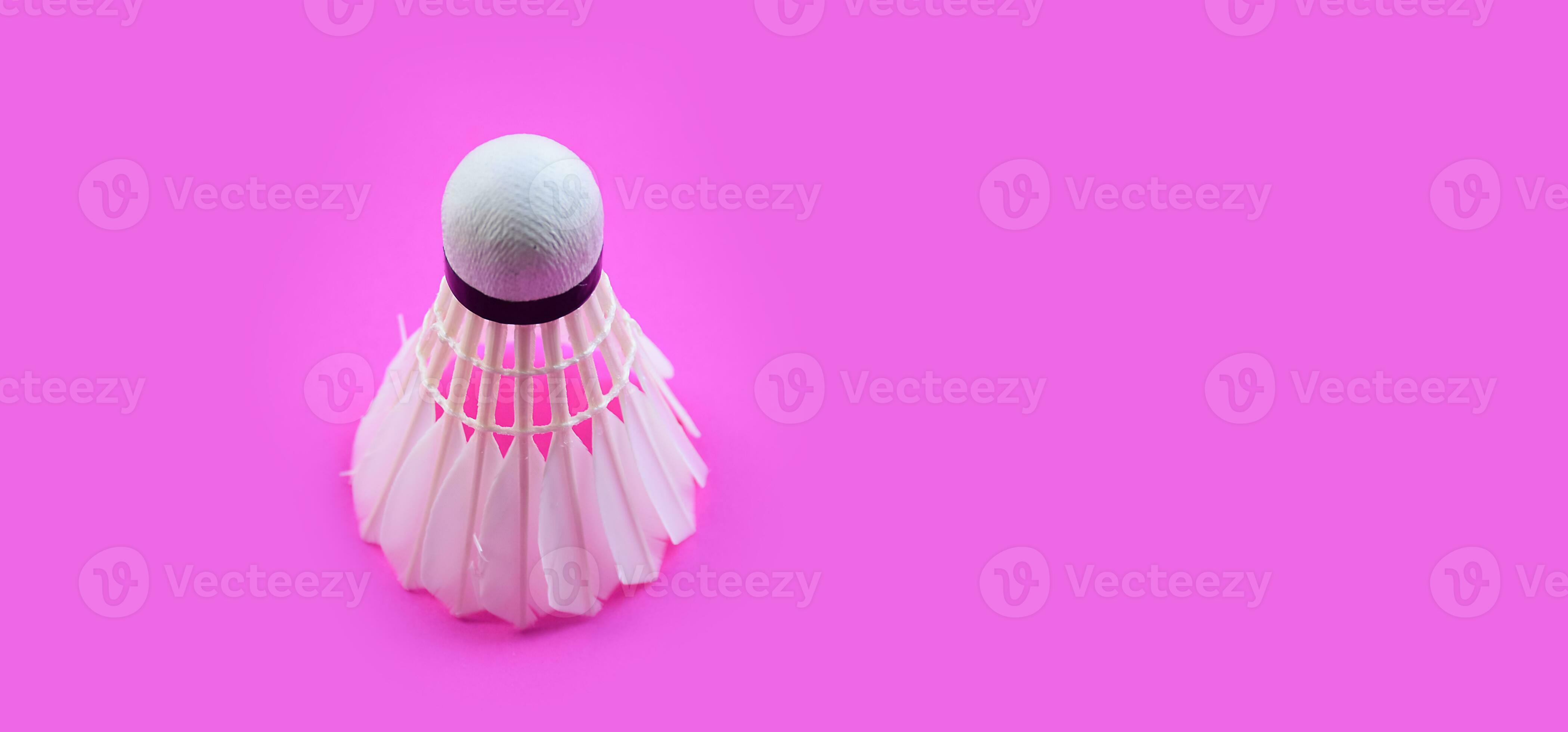 Cream white badminton shuttlecock and racket on floor in indoor ... Cream white badminton shuttlecock and racket on floor in indoor ...