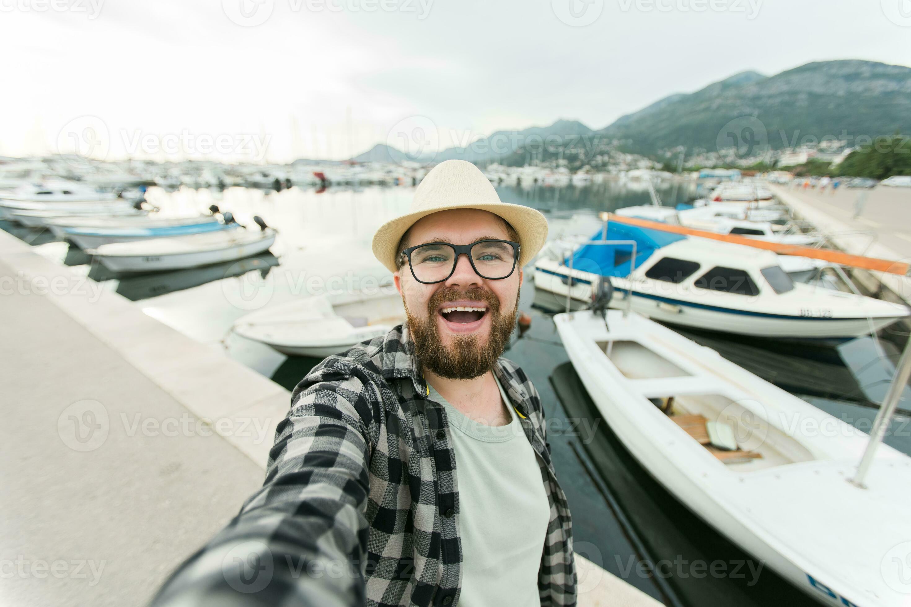 Traveller man taking selfie of luxury yachts marine during sunny day ...