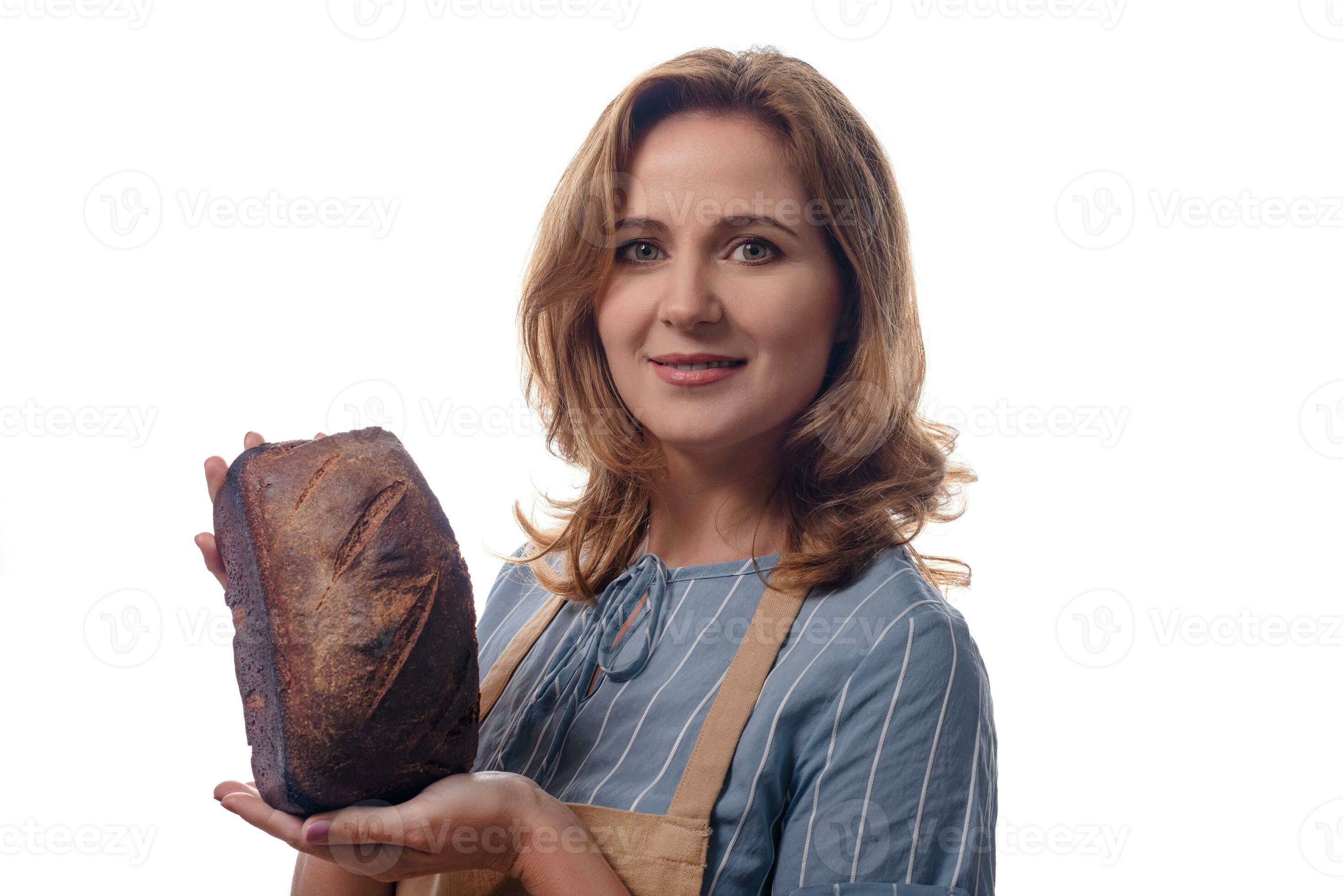 Close Up Portrait Of Woman In Apron Showing A Sourdough Homemade Bread Isolated On White