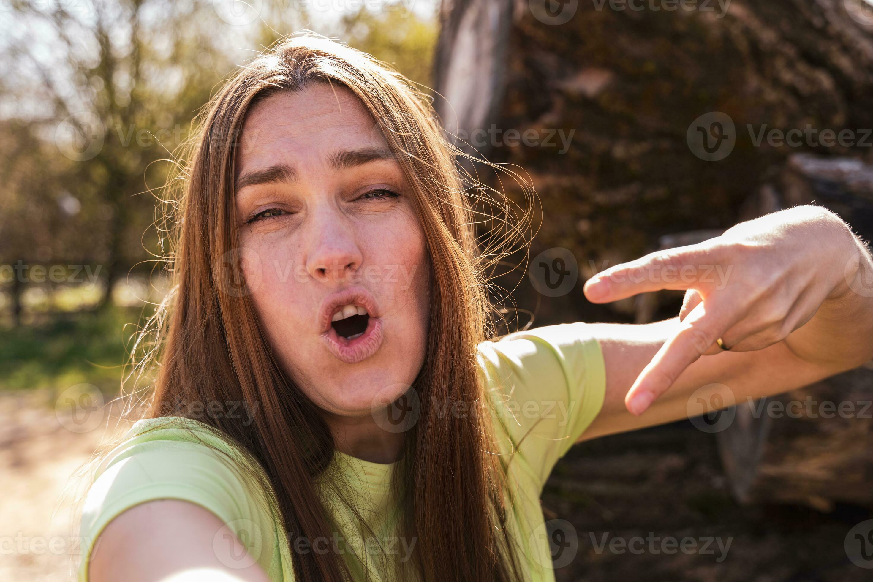 Beautiful Woman Taking Selfie Outdoors During A Happy Walk In The