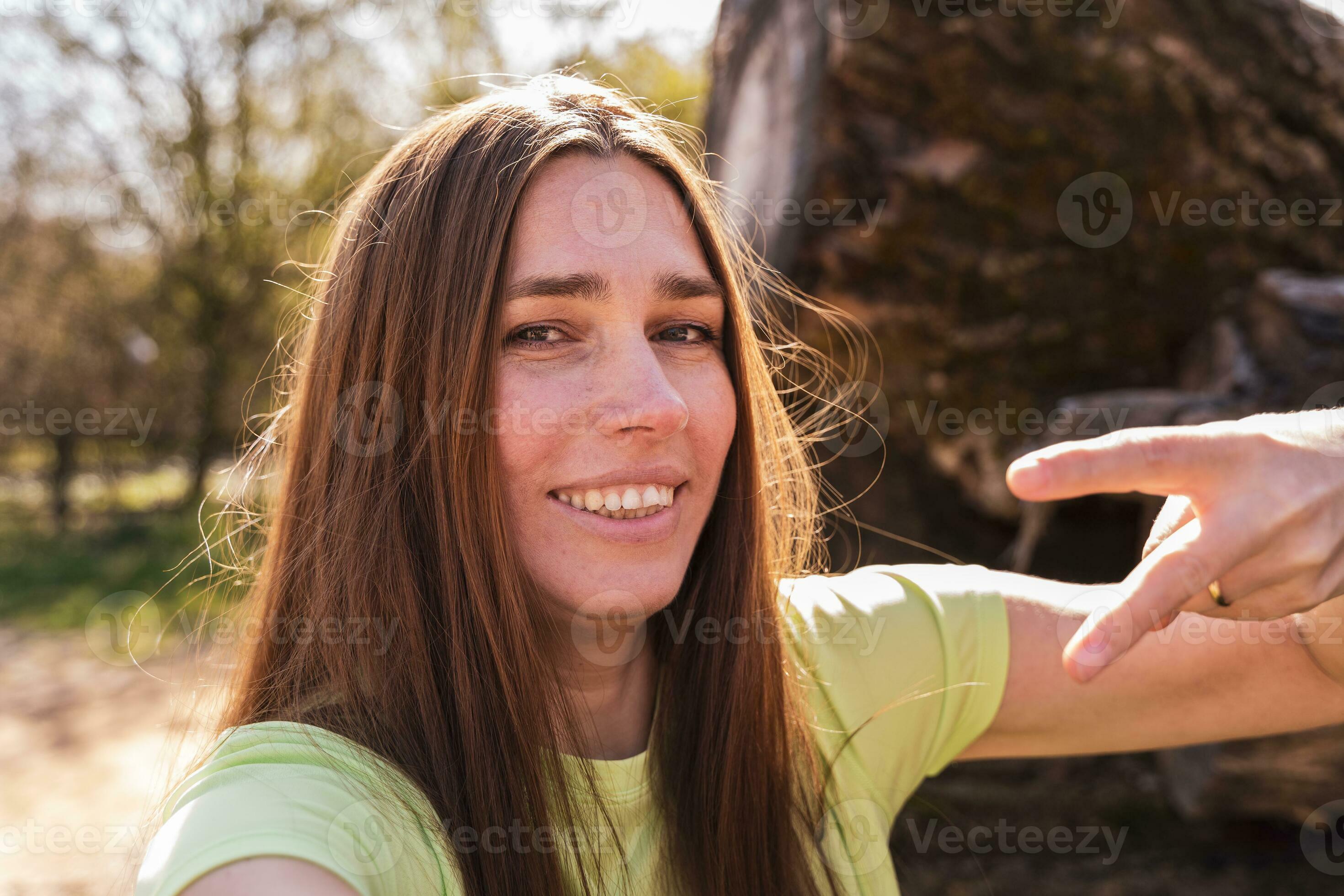 Beautiful Woman Taking Selfie Outdoors During A Happy Walk In The