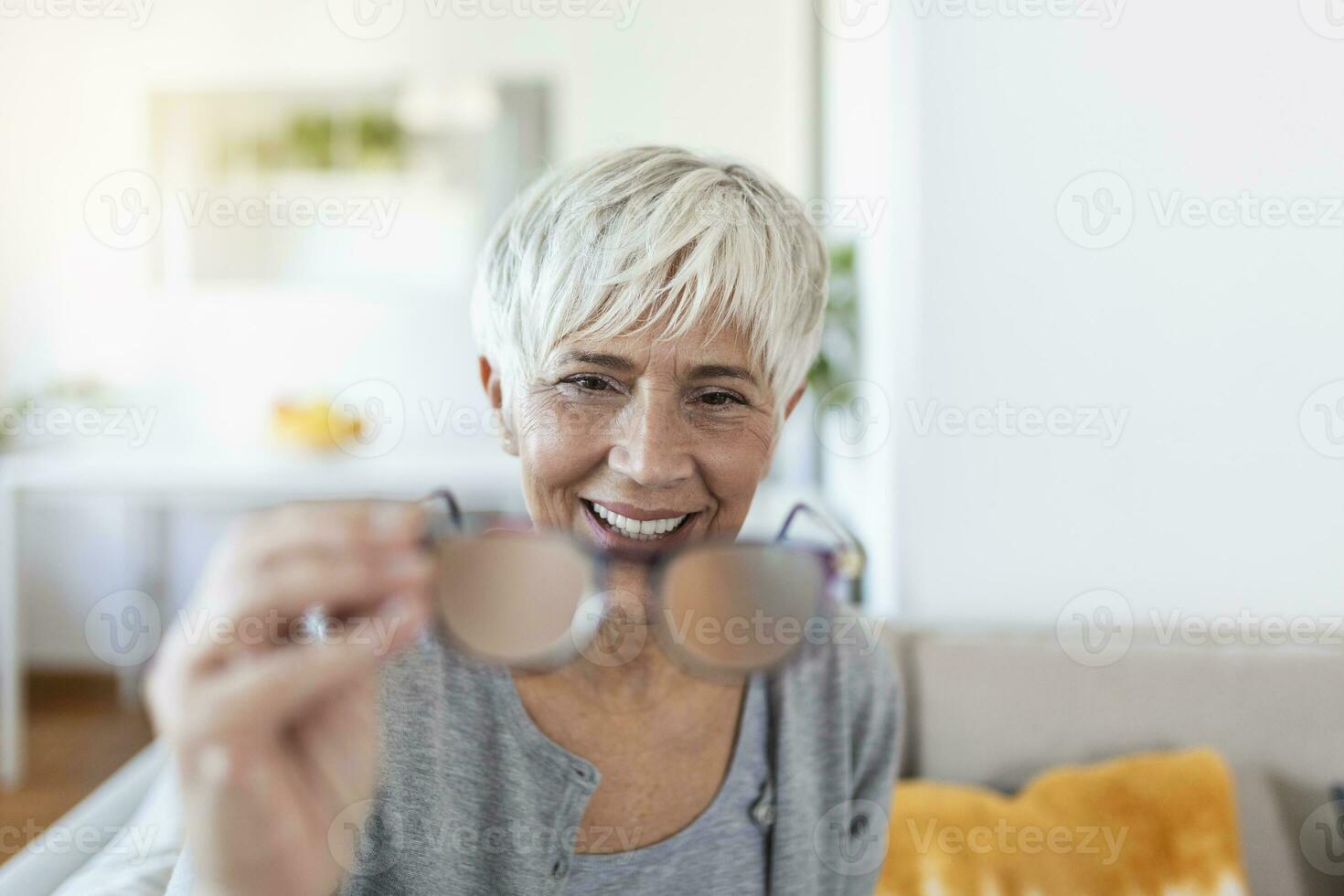 Mature Woman Holds Glasses With Diopter Lenses And Looks Through Them The Problem Of Myopia