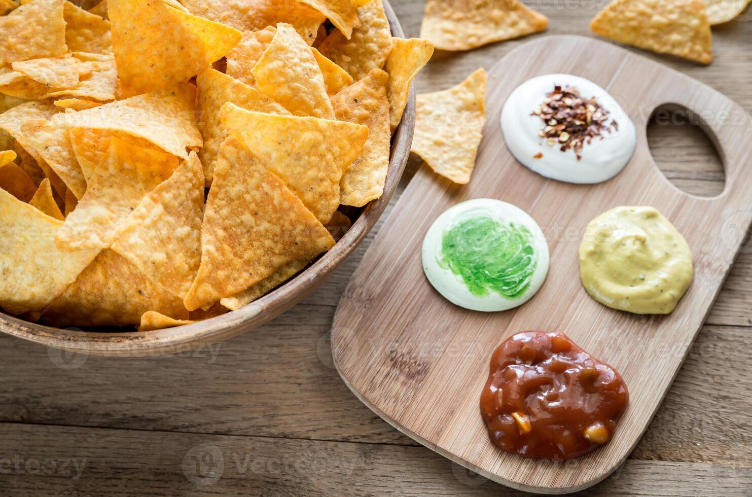 Cheese Nachos With Different Types Of Sauce 26523196 Stock Photo At cheese-nachos-with-different-types-of-sauce-26523196-stock-photo-at