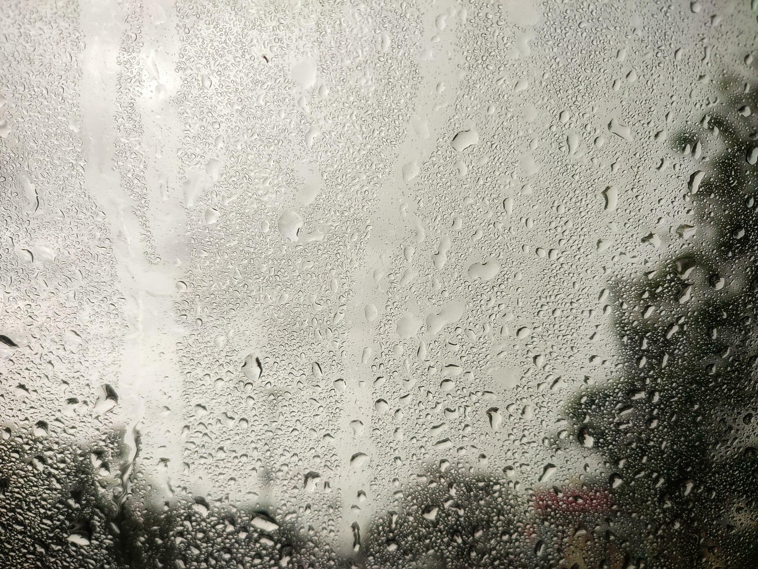 Abstract background of drops of water flow down at windshield. 26575920 ...