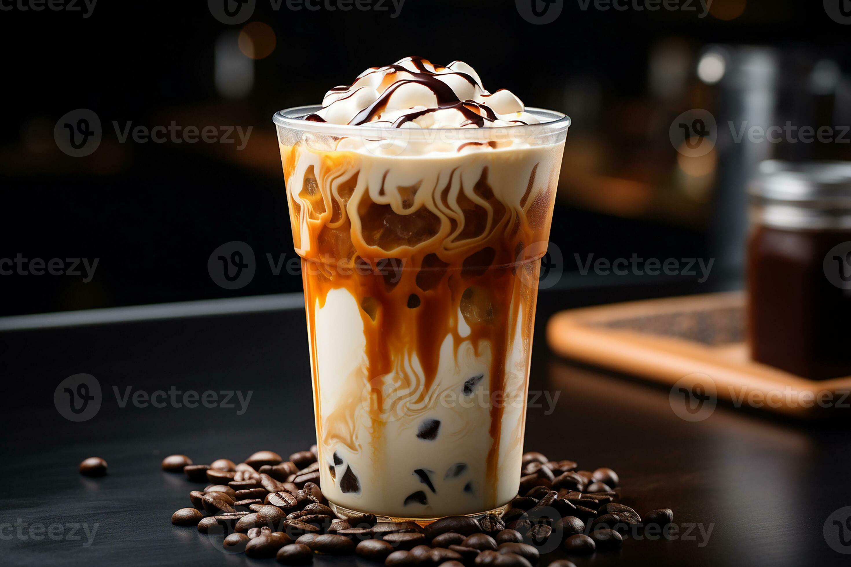 Iced Coffee Latte With Milk Mixture And Cream Topping Chocolate Sauce Served In Clear Glass