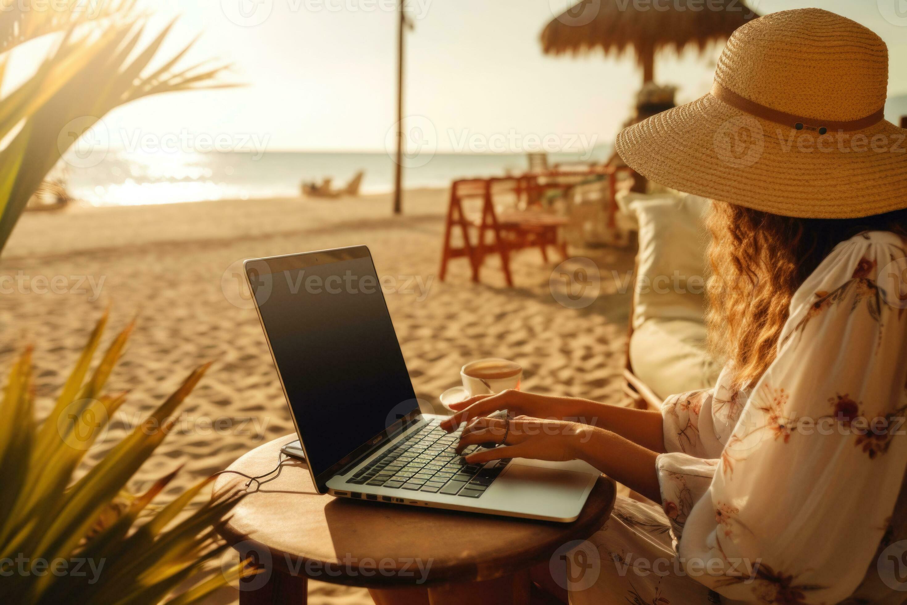 Woman working with laptop computer at the beach. Working while ... Woman working with laptop computer at the beach. Working while ...