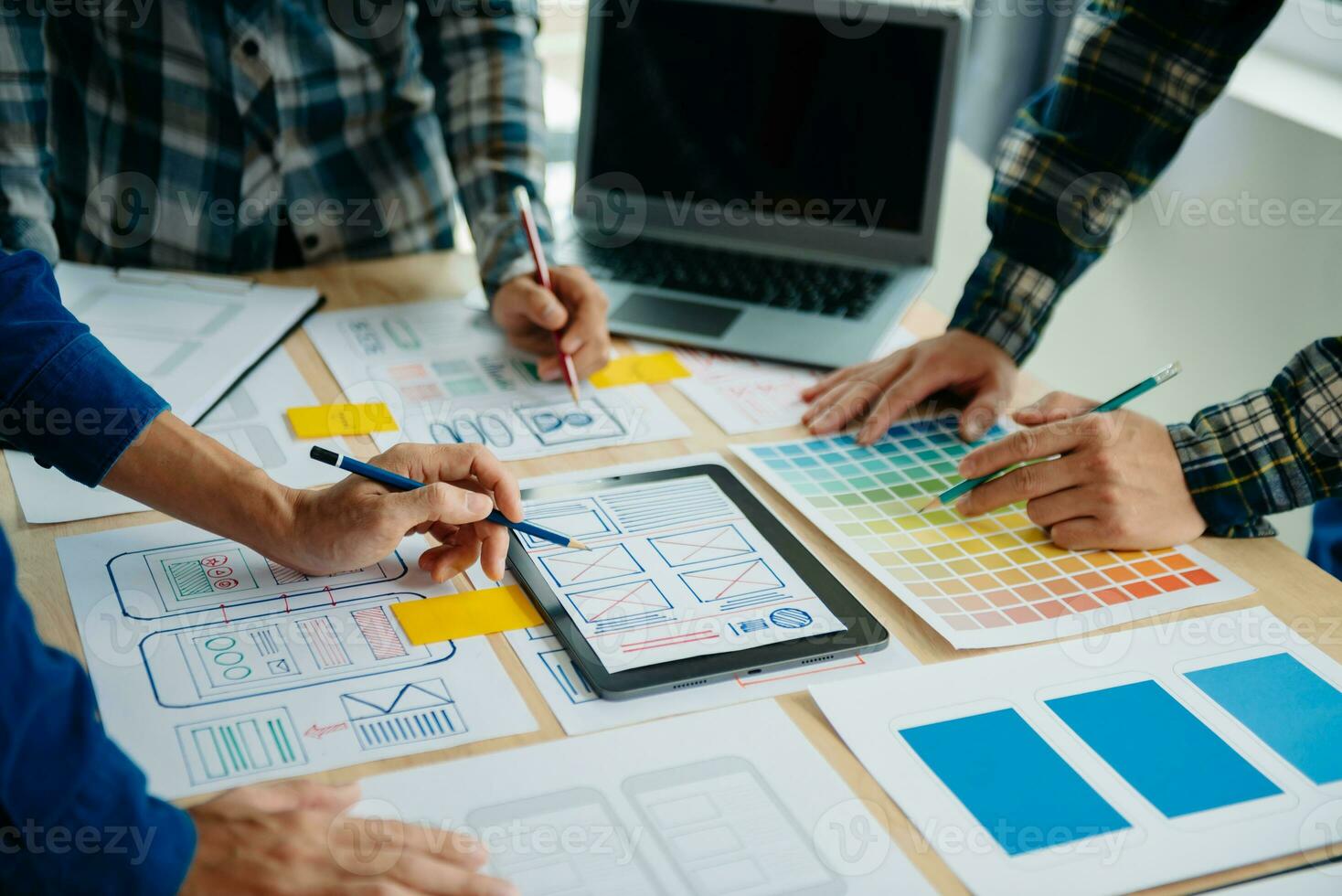 Ux Developer And Ui Designer Brainstorming About Mobile App Interface Wireframe Design With