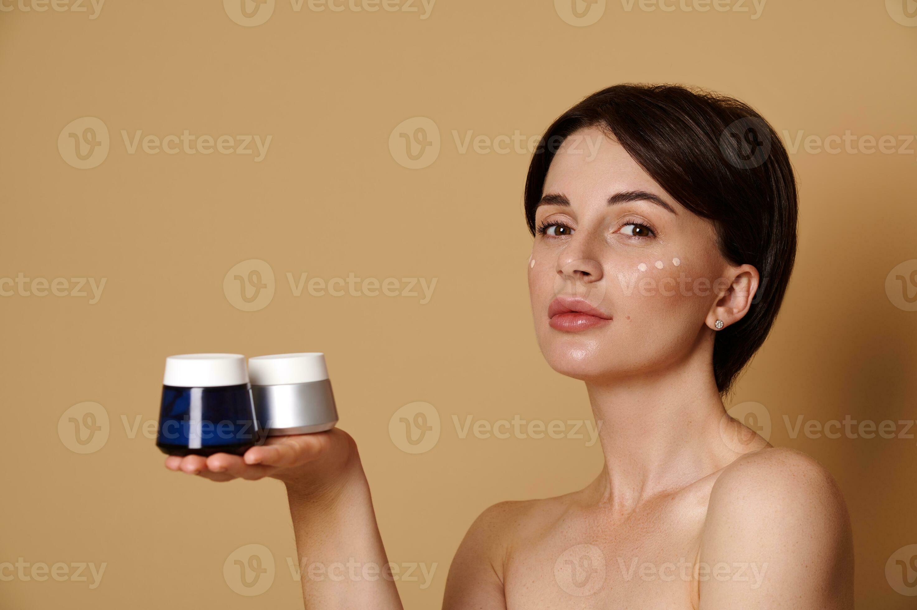 Beautiful Dark Haired Caucasian Woman Holding Jars With Moisturizer On