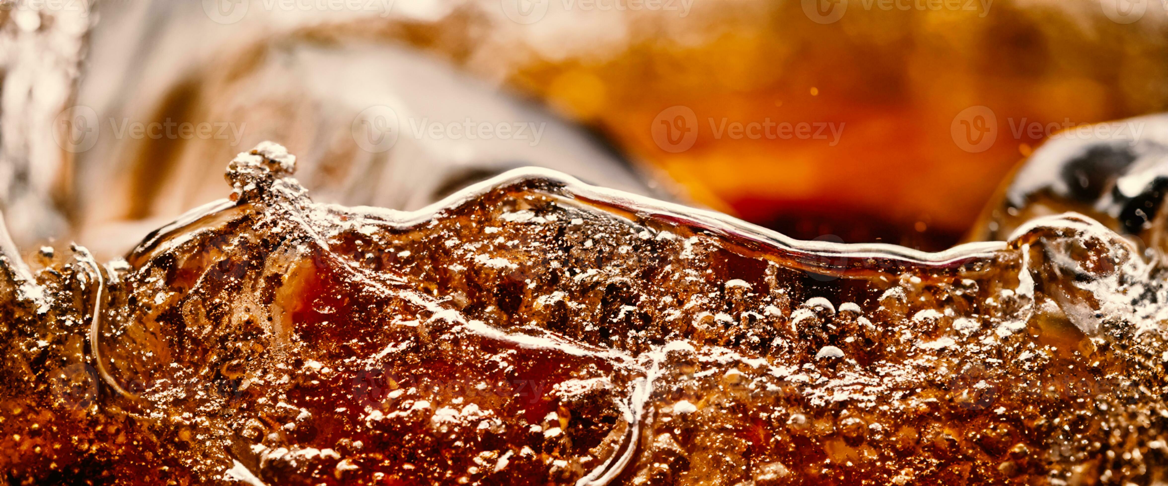Splashing of Cola and Ice. Cola soda and ice splashing fizzing or floating up to top of surface ...