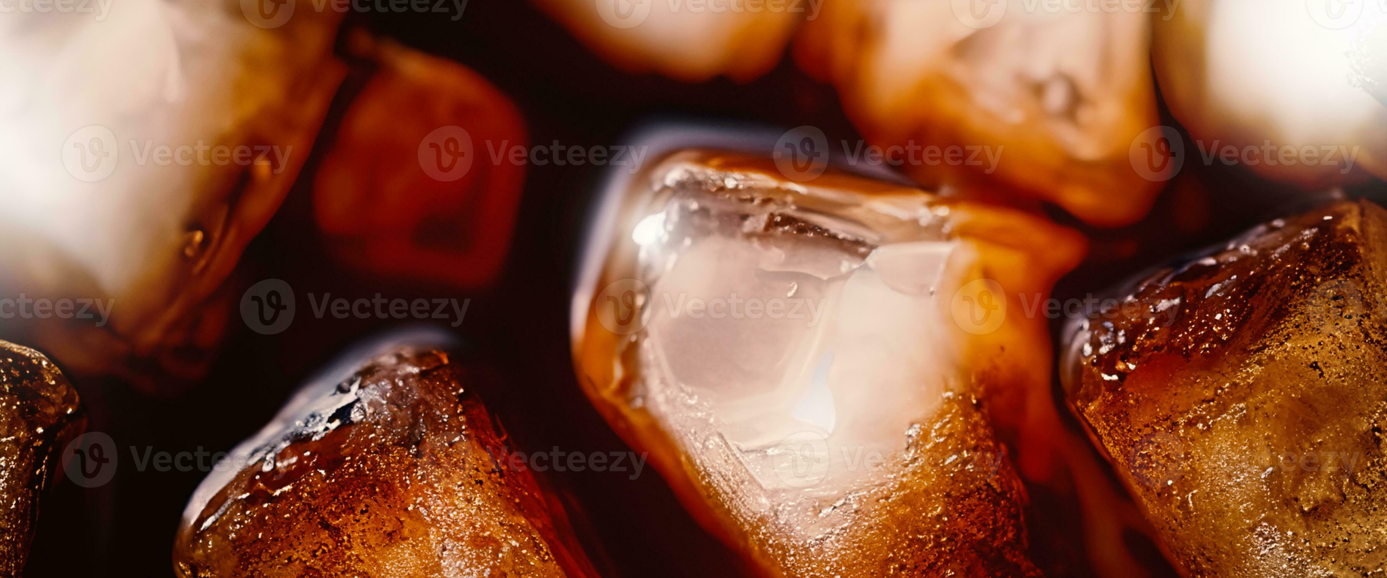 Cola with Ice. Close up of the ice cubes in cola water. Texture of carbonate drink with bubbles ...