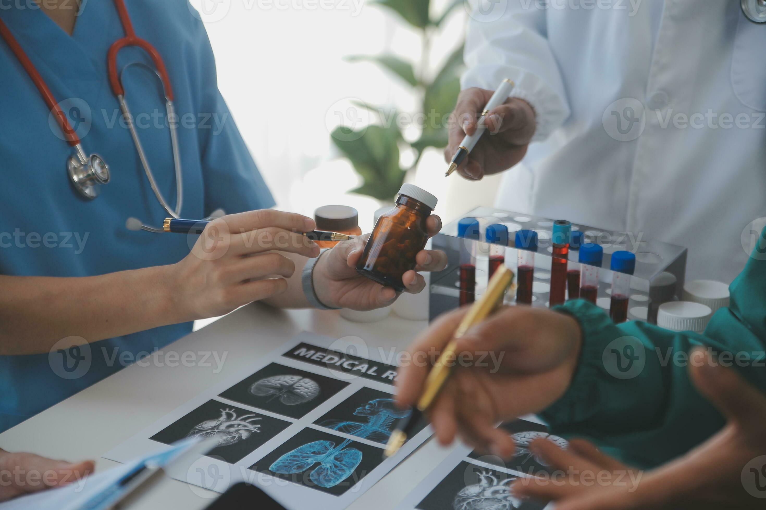 Cropped image of successful medical doctors discussing diagnosis during ... Cropped image of successful medical doctors discussing diagnosis during ...